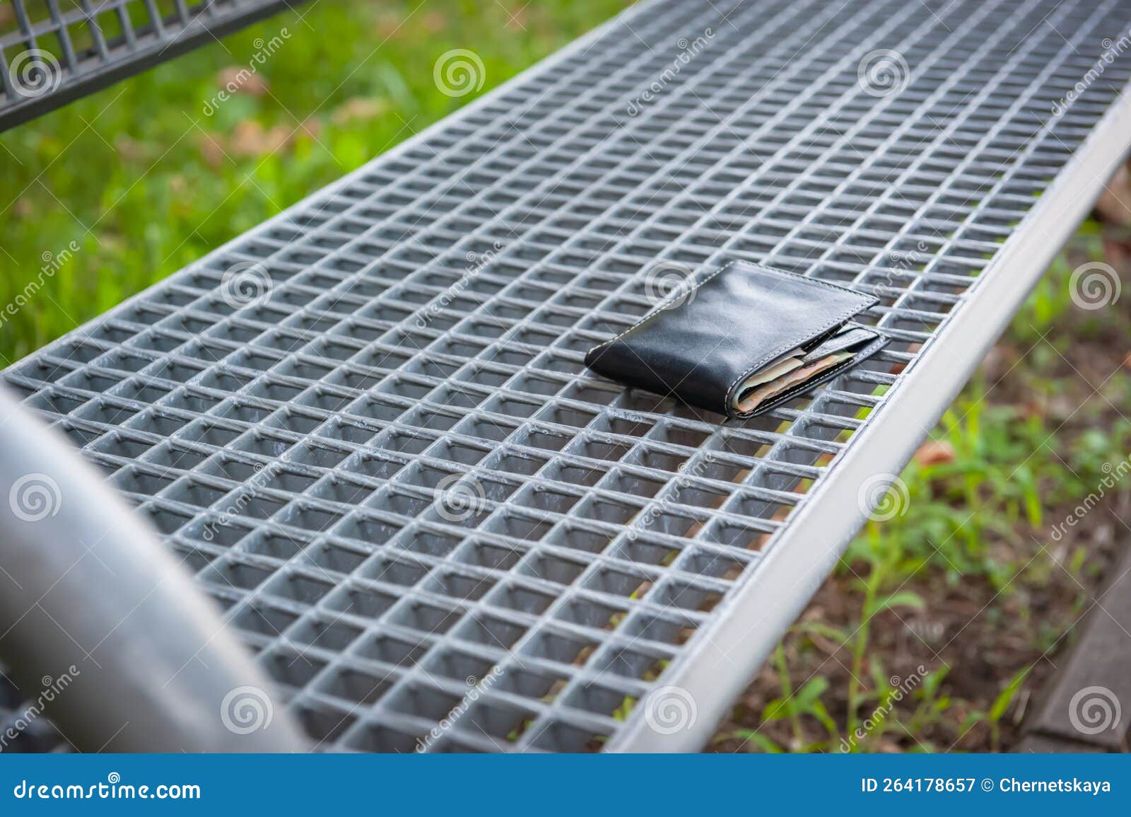 Black Wallet on Metal Bench Outdoors, Space for Text. Lost and Found ...