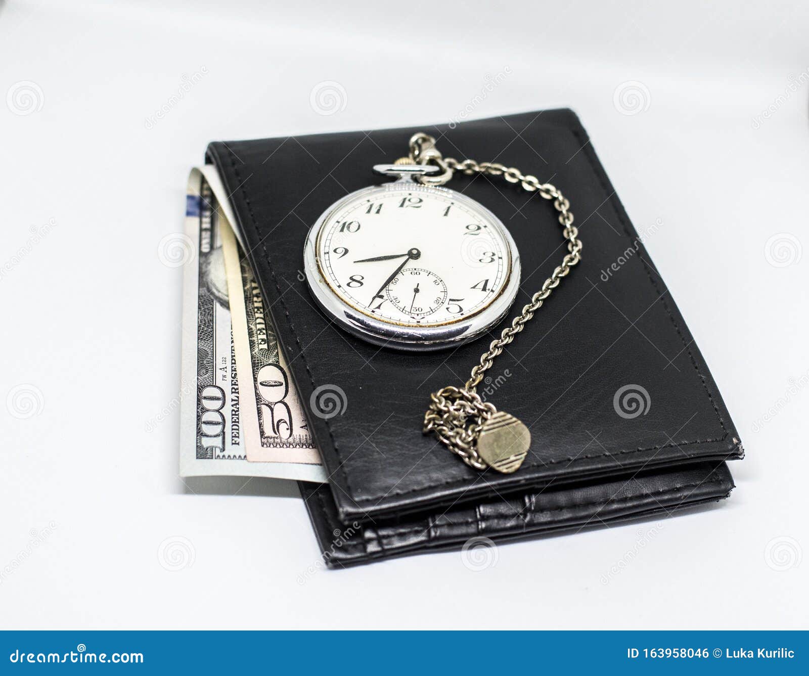 Black Wallet with Paper Money and Clock on the Chain Stock Photo ...