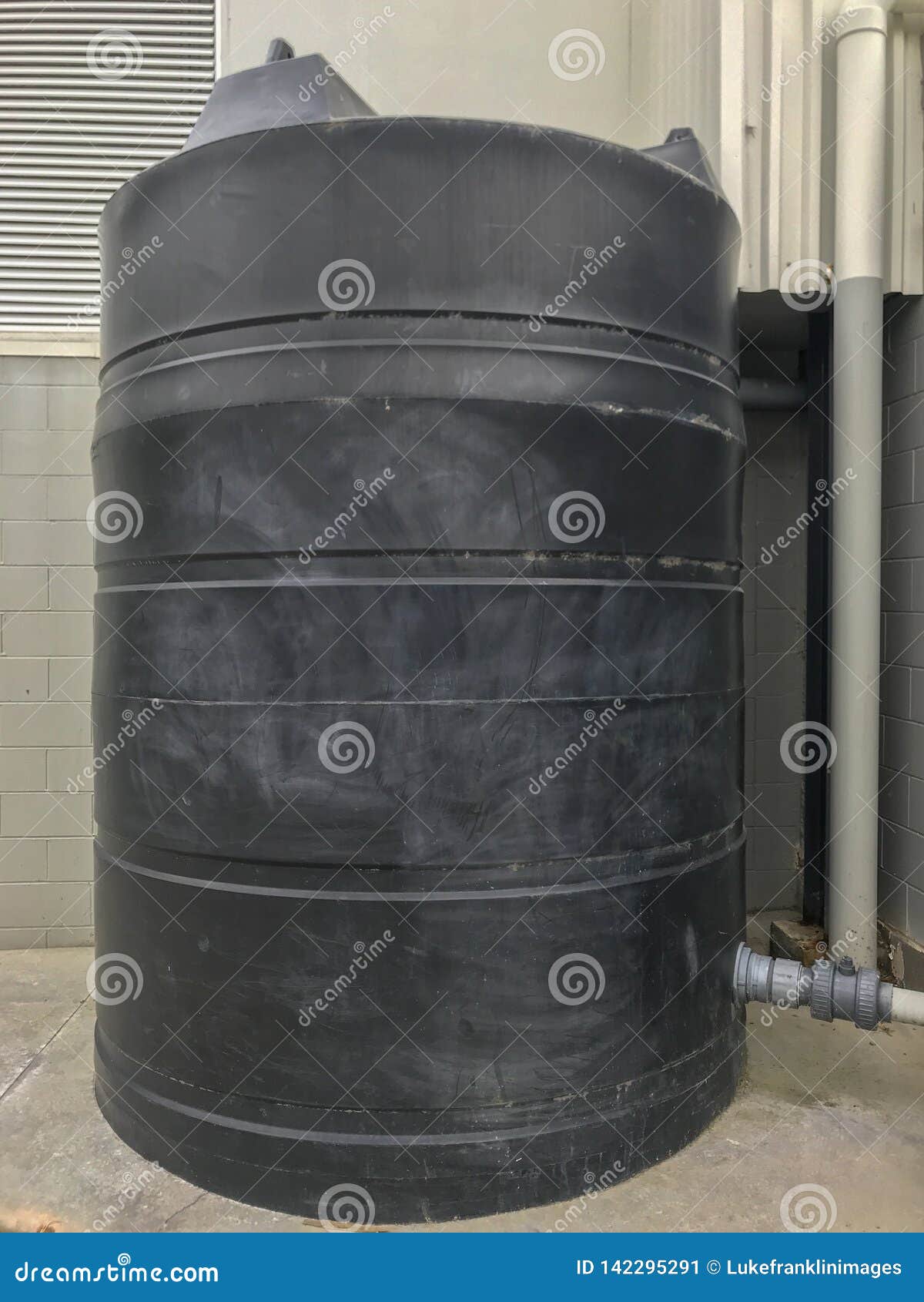 Black water storage drum stock image. Image of chemical - 142295291