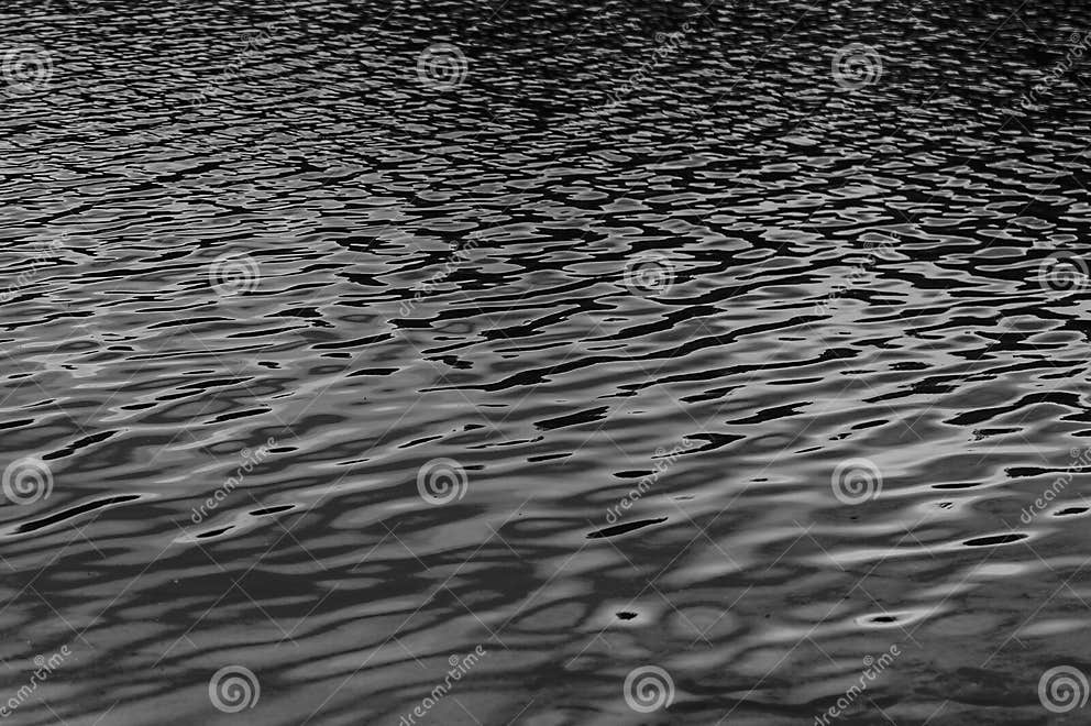 Black Water Surface with Waves. Water Ripples Stock Image - Image of ...