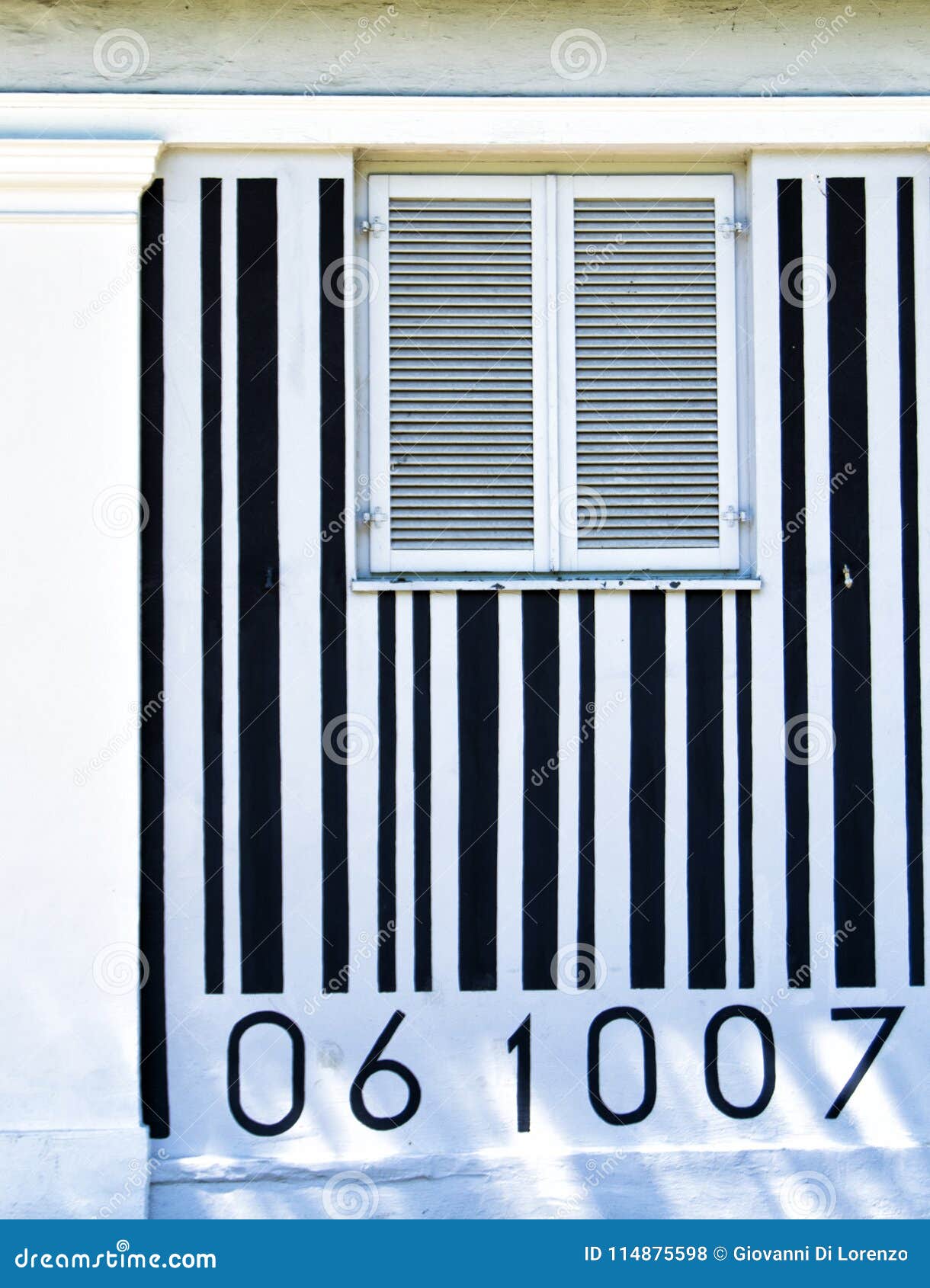 Black and White Barcode Painted on a House Wall with a Window in the ...