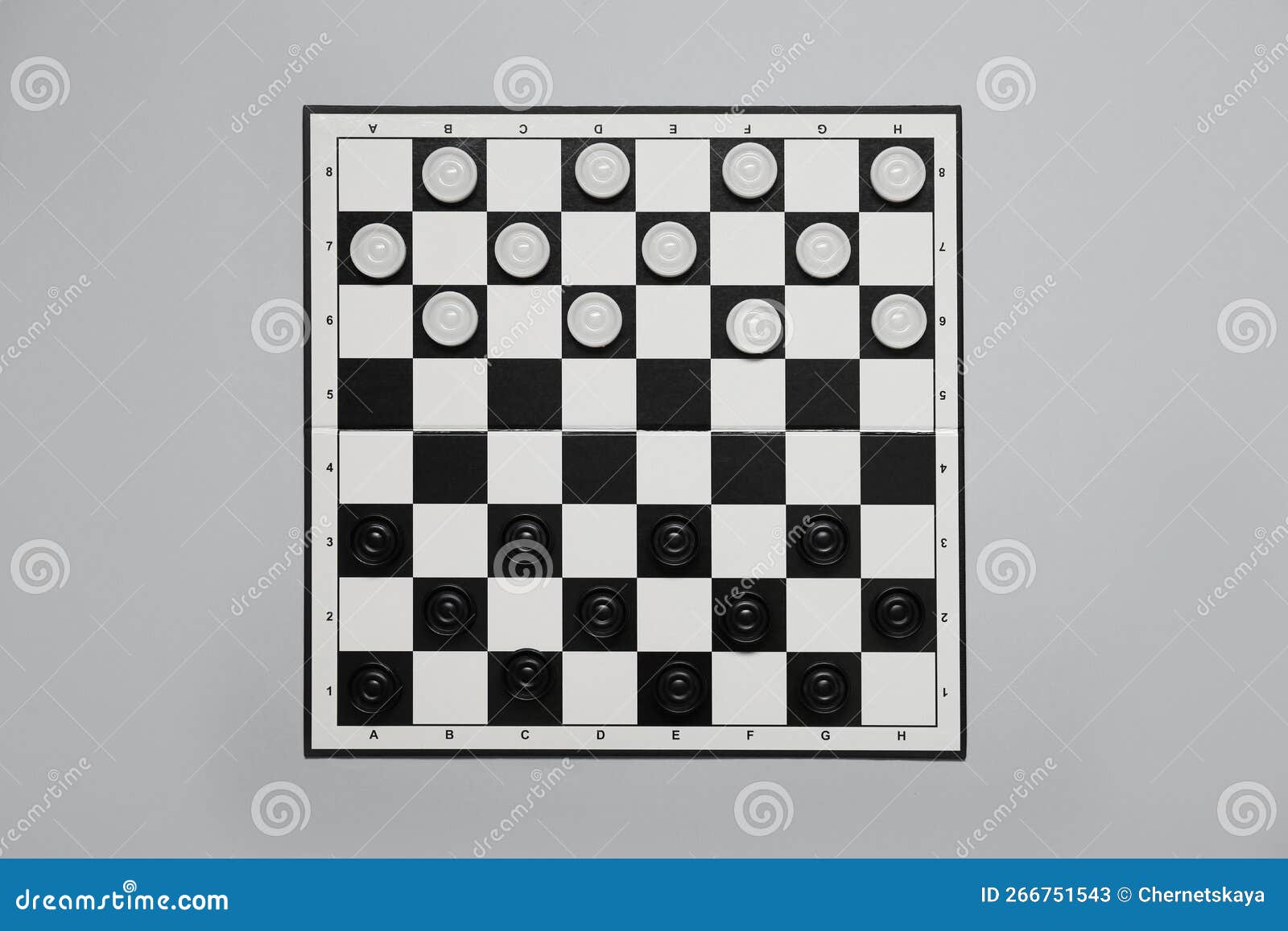 Black and White Checkerboard with Game Pieces on Light Grey Background ...