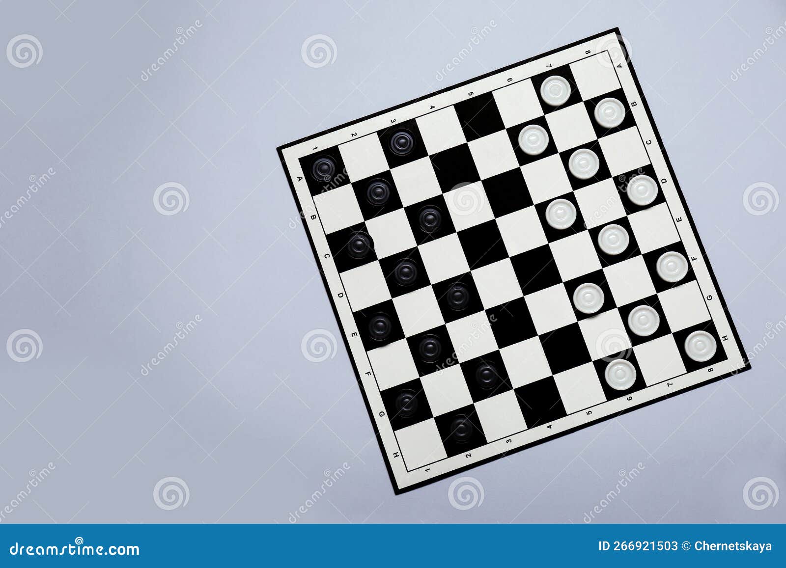 Black and White Checkerboard with Game Pieces on Light Grey Background ...