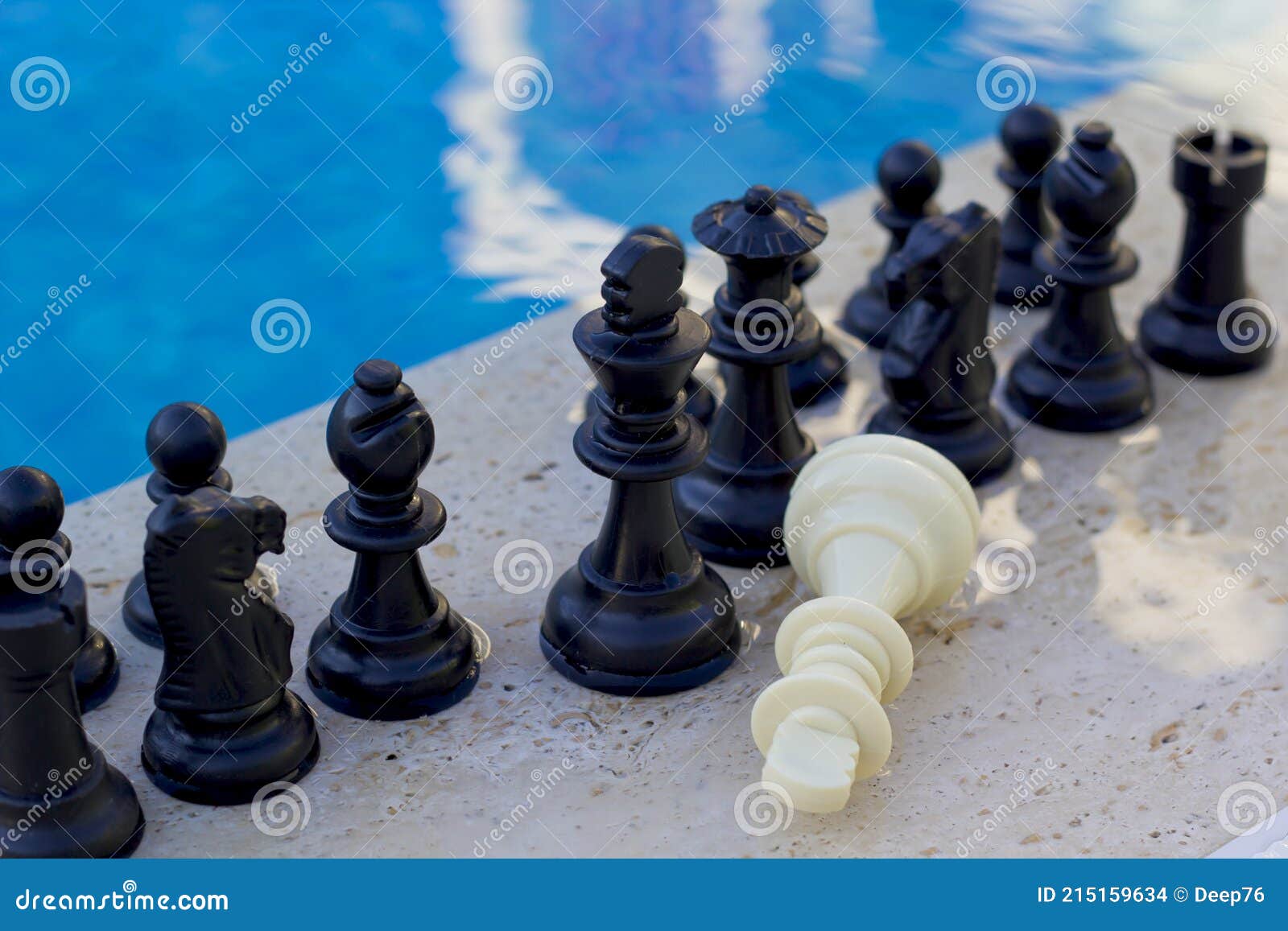 Black and White Chess Pieces at the Pool Stock Photo - Image of piece ...