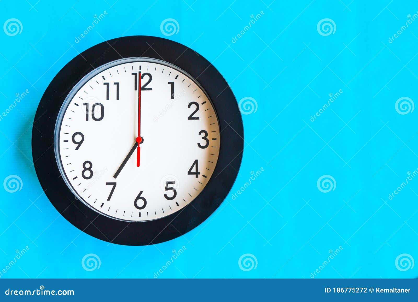 A Black and White Clock on a Blue Wall Stock Photo - Image of modern ...