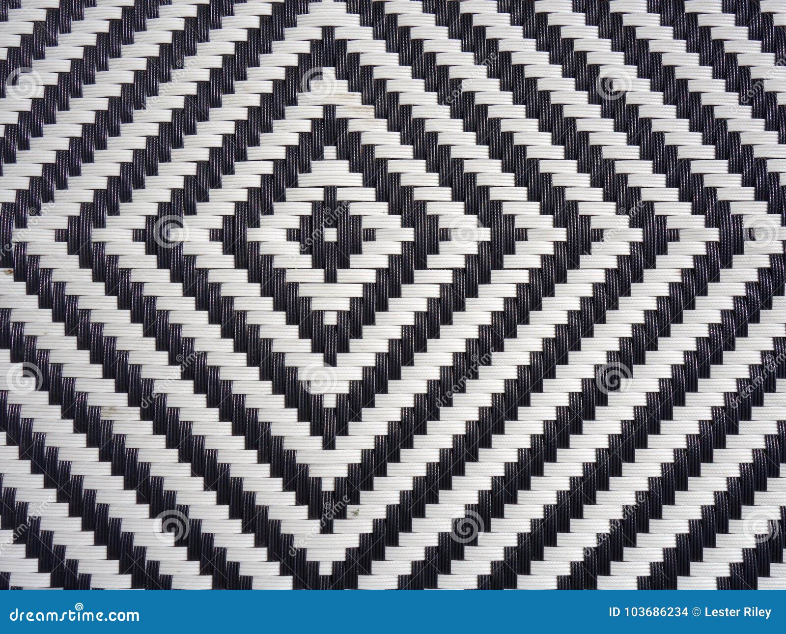 A Black and White Diamond Pattern Formed in Woven Plastic As a ...