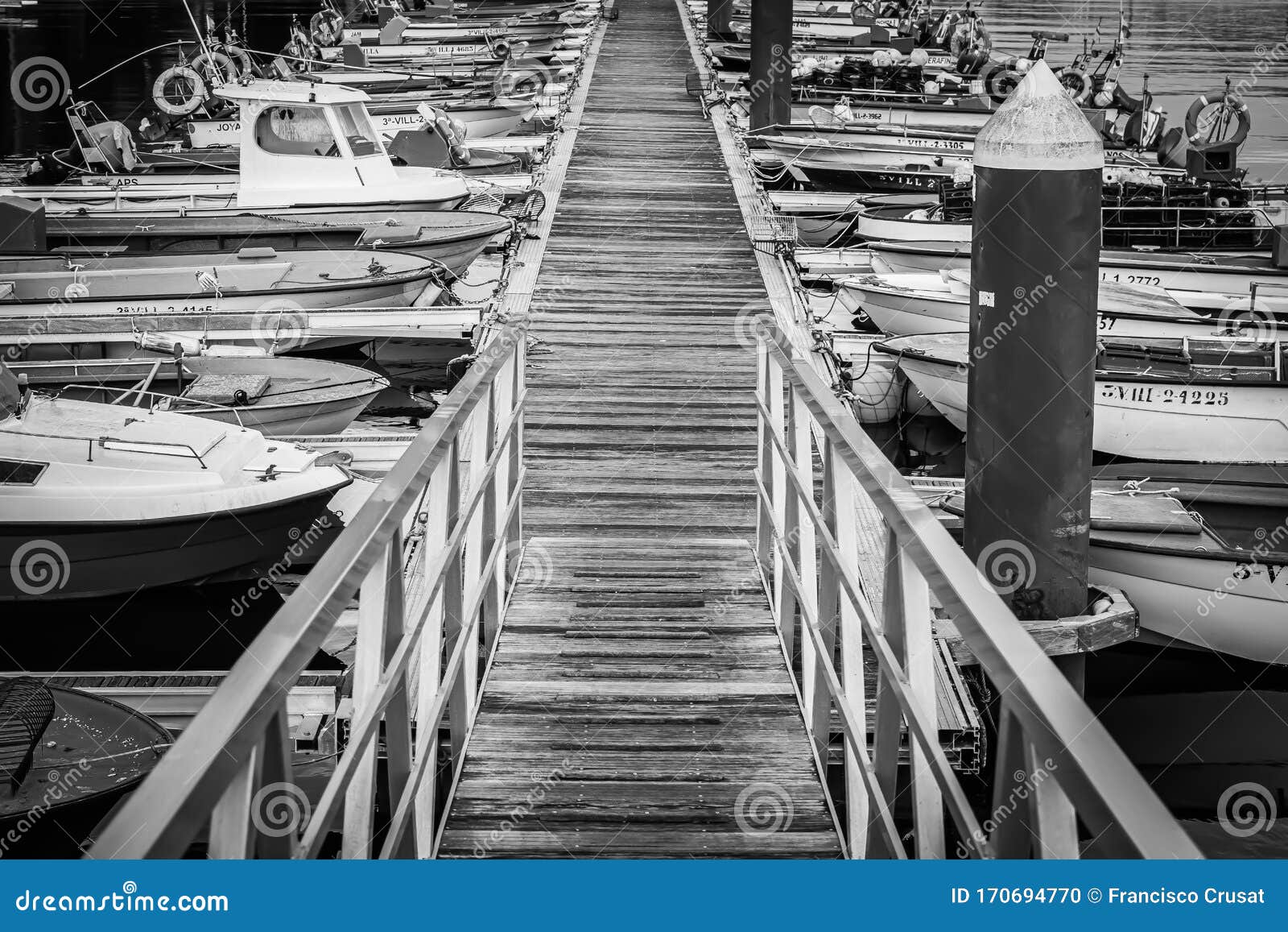 A White Dock Bridge With A Lake And Green Trees Royalty-Free Stock ...