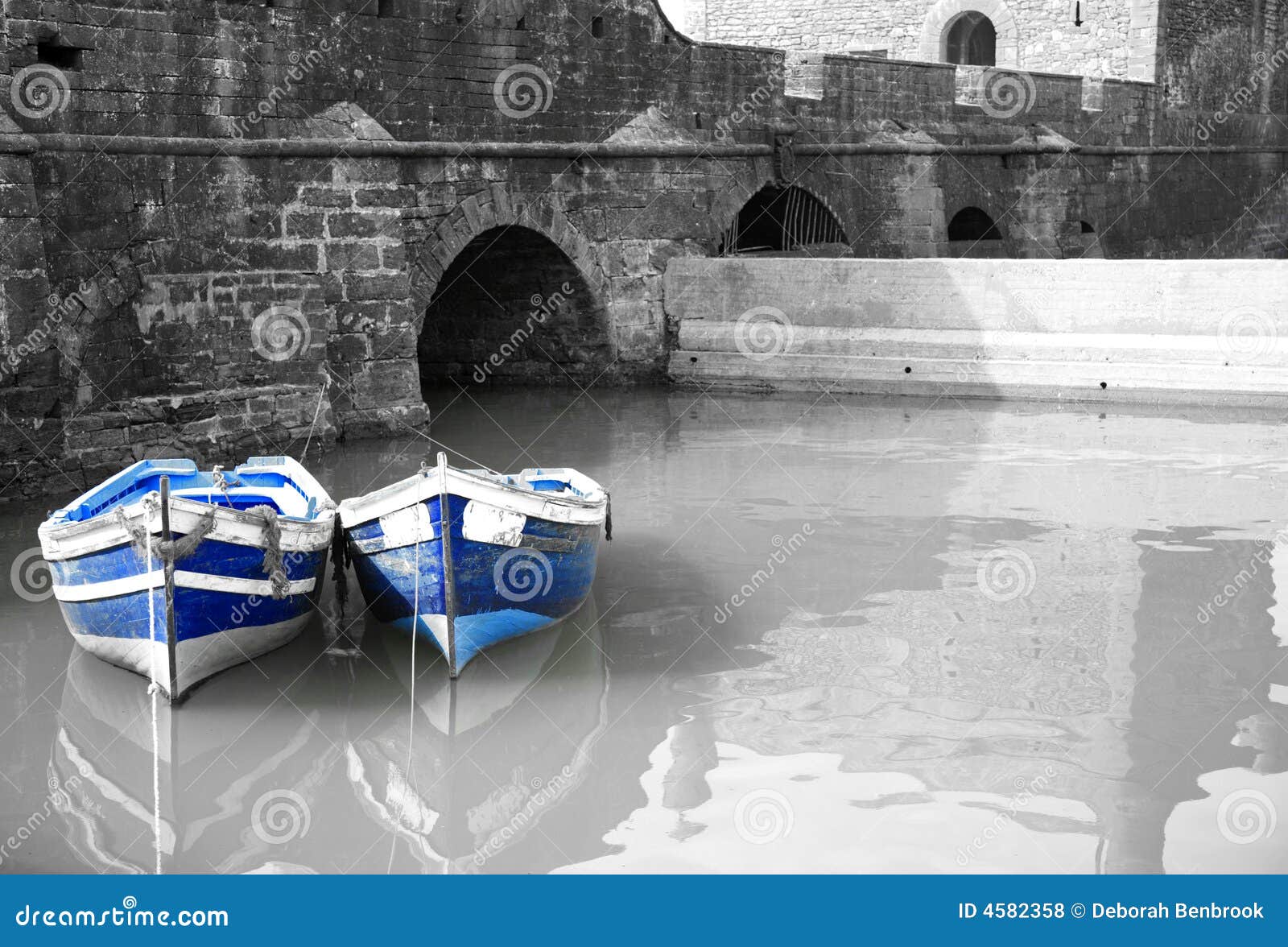 Black And White Harbour With Two Blue Boats Picture. Image: 4582358