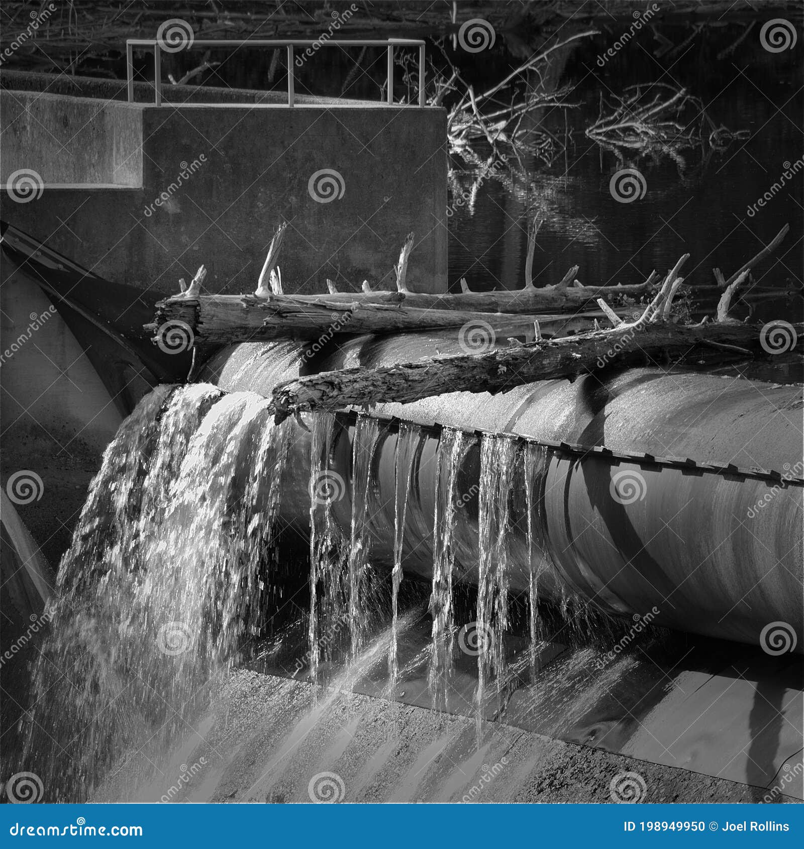 A Black & White Image Depicting Logs Going Over a Dam Stock Photo ...