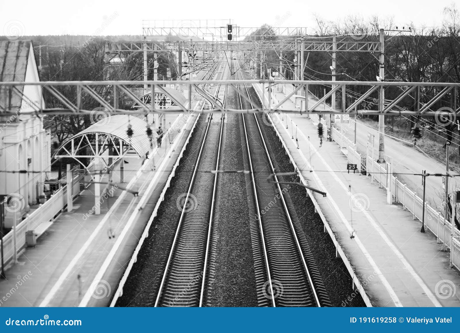 Black-white Image Of Long Railway Tracks And Half-empty Stations Stock ...
