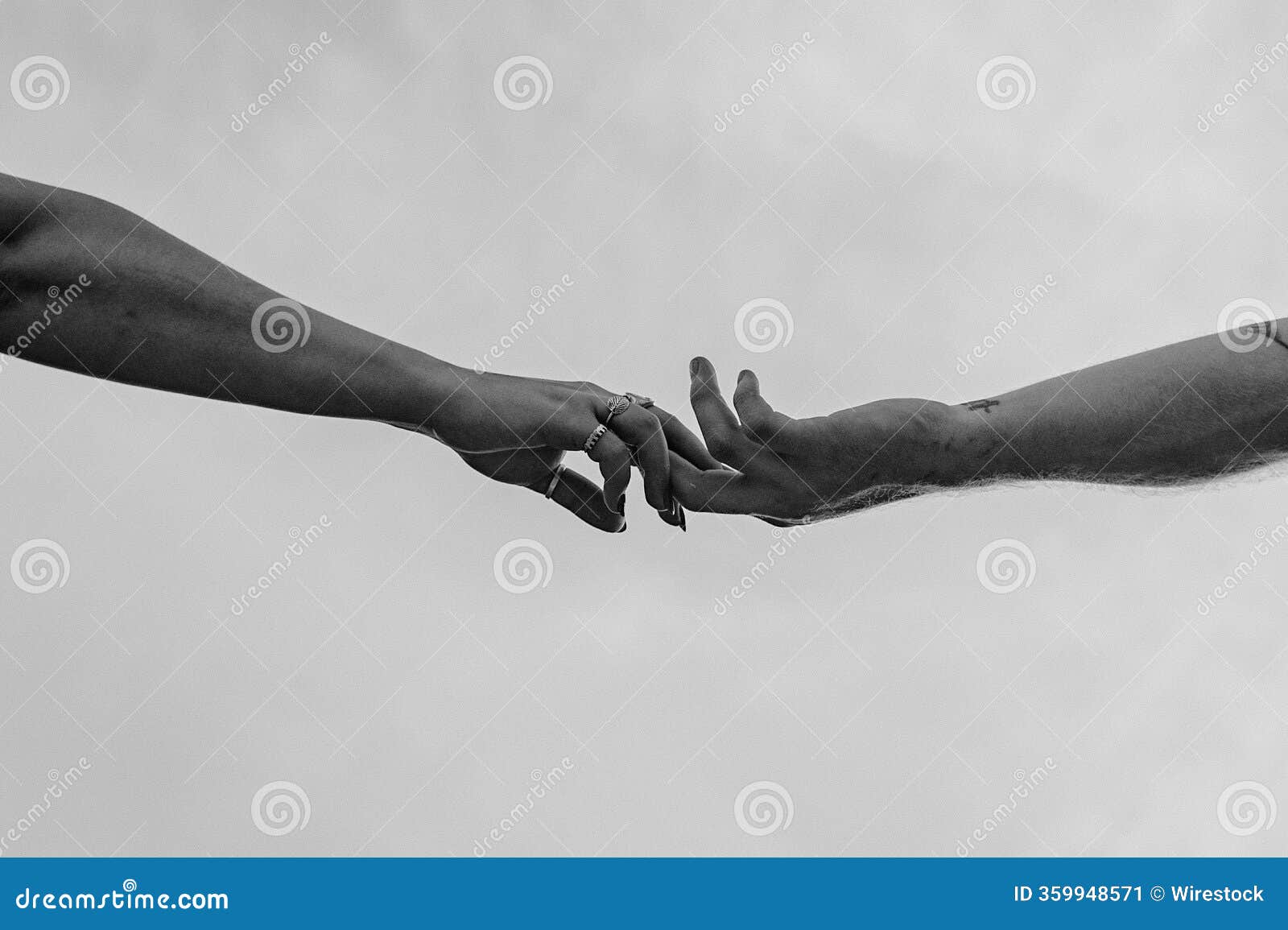 Black and White Image of Two Hands Reaching Out, Symbolizing Connection ...