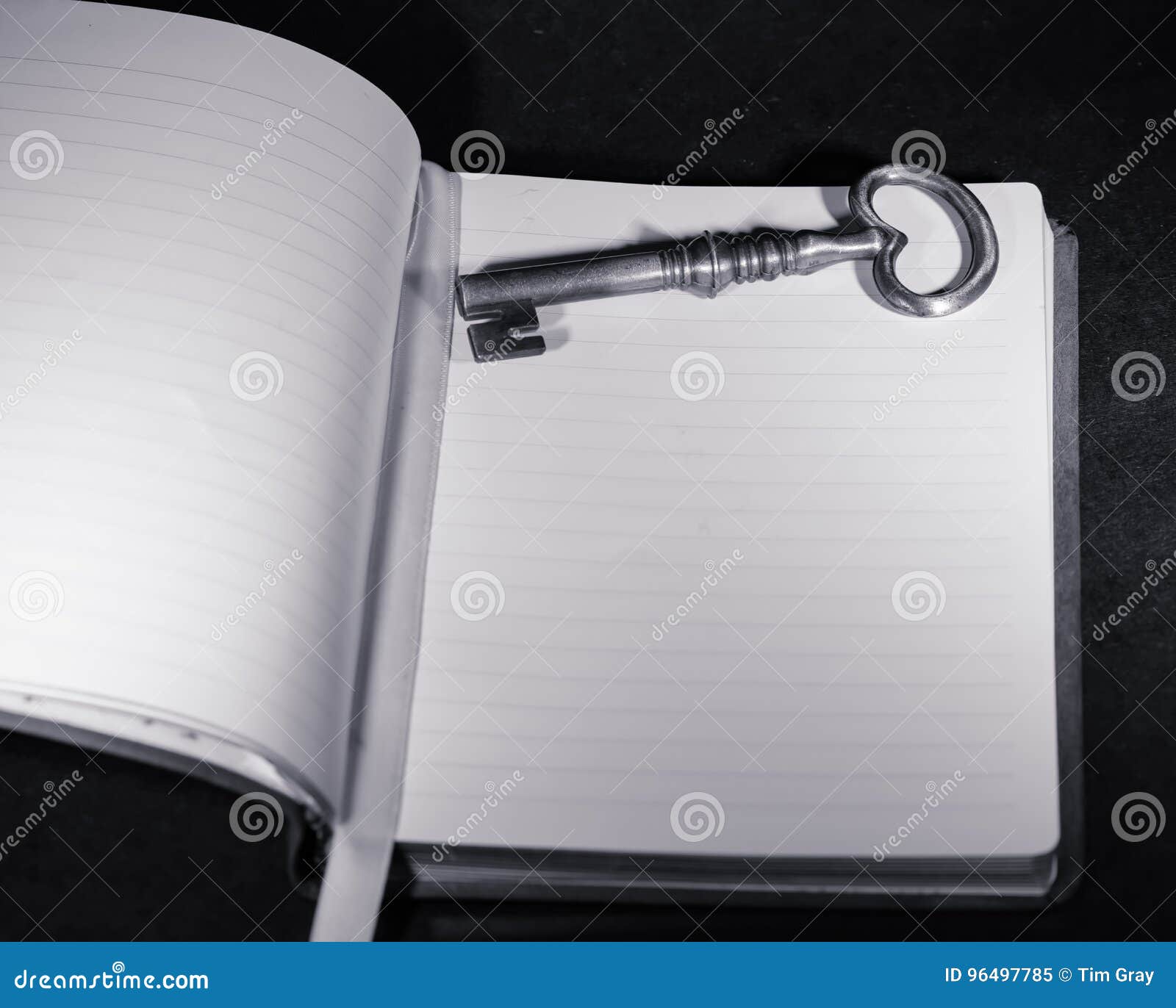 Black and White Key on Writing Journal Stock Image - Image of pages ...