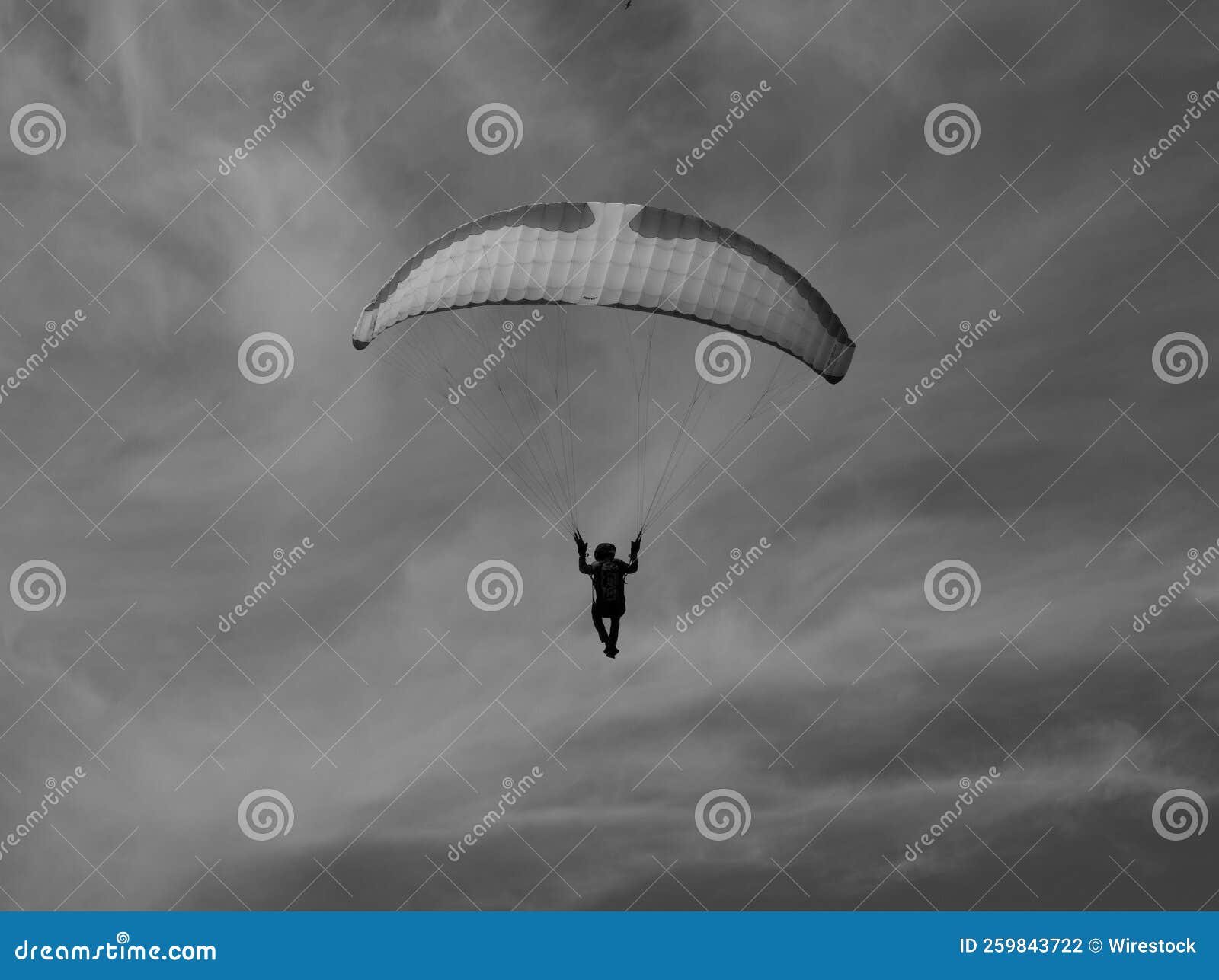 Black and White of a Paraglider Flying in the Sky. Stock Photo - Image ...