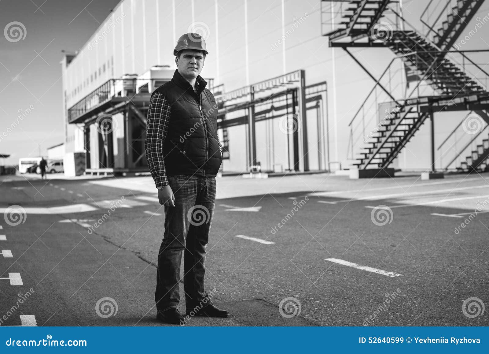 Black and White Photo of Engineer Standing on Building Site Stock Image ...