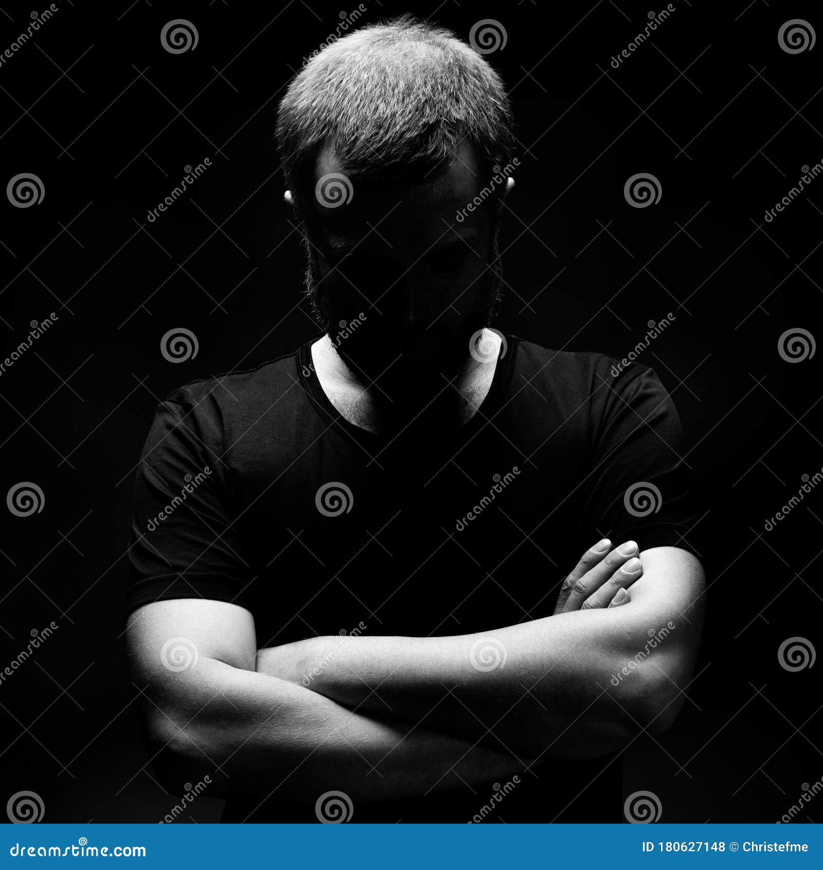 Photo of Man with Head Down and Face in Shadow Stock Photo - Image of ...