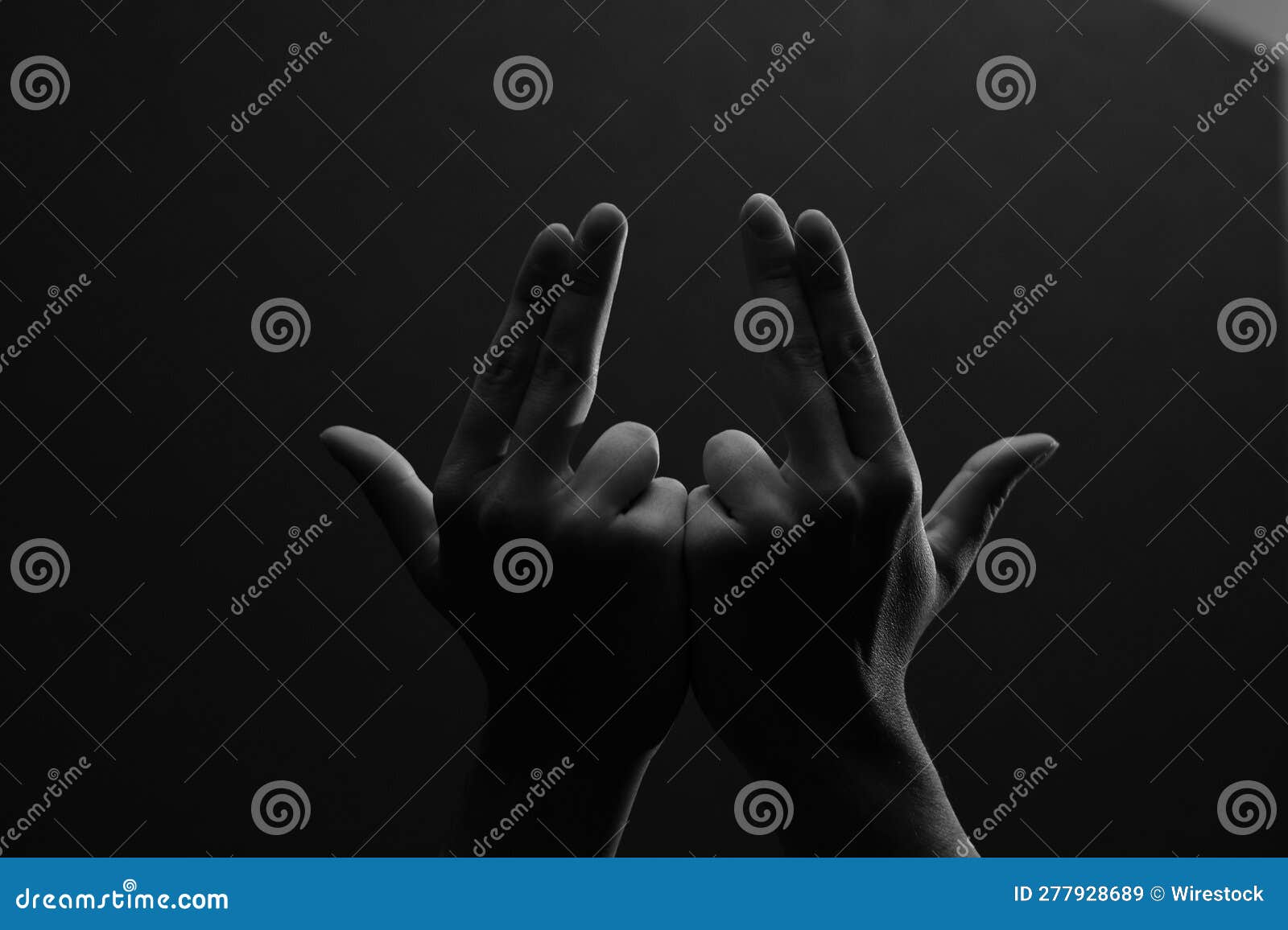 Black and White Photograph Featuring Two Hands Doing a Jul Gesture ...
