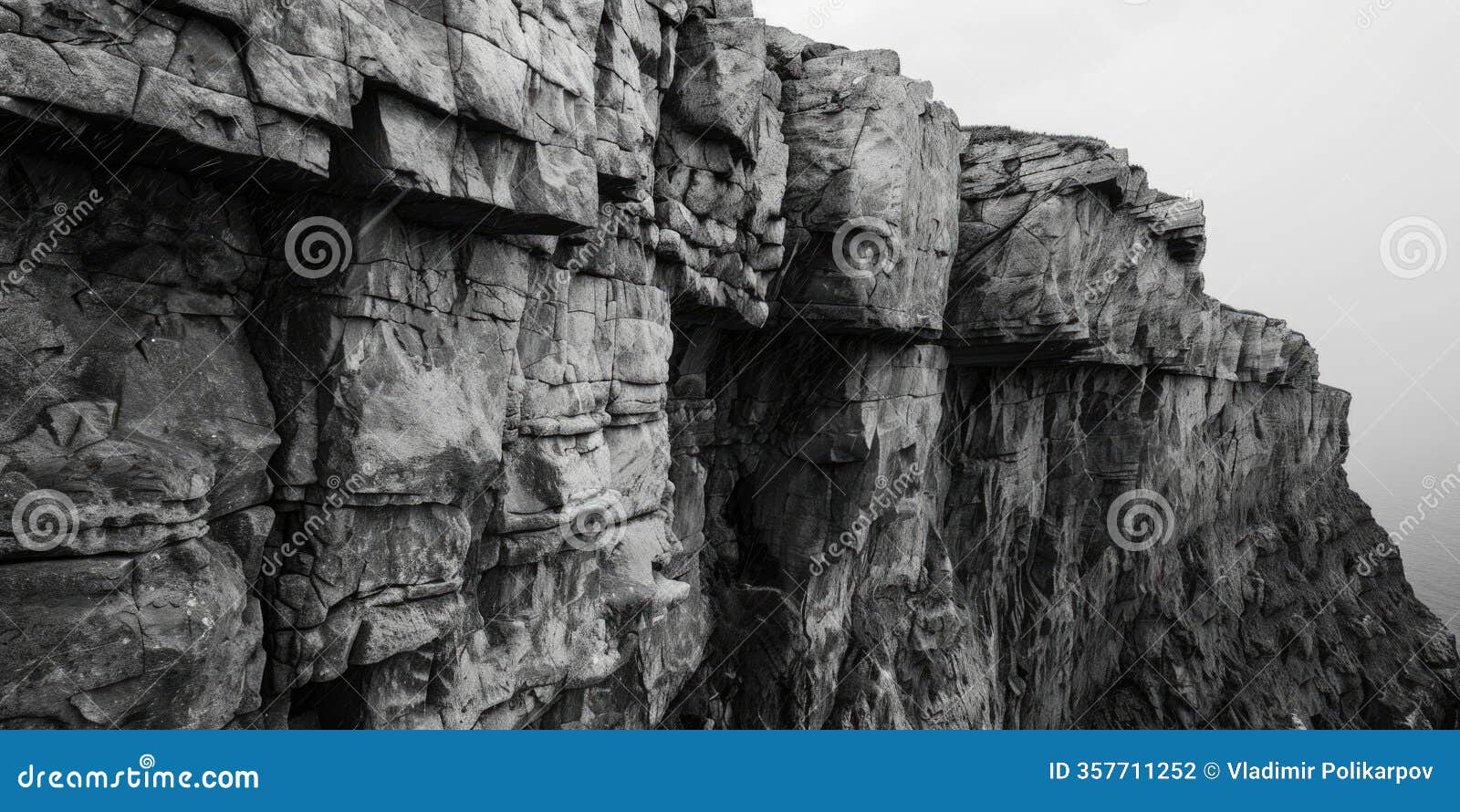A Black and White Photograph of a Rugged Cliff Face with Texture and ...