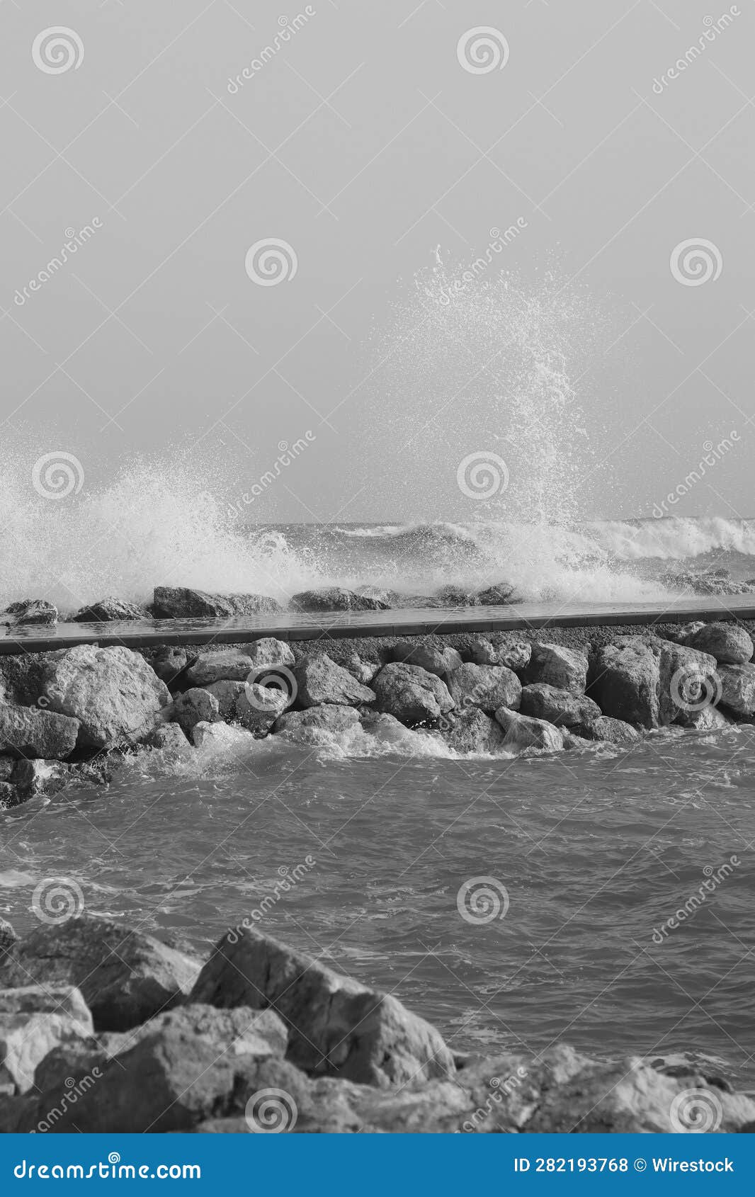 Black and White Photograph of the Seashore Featuring Waves and Jagged ...