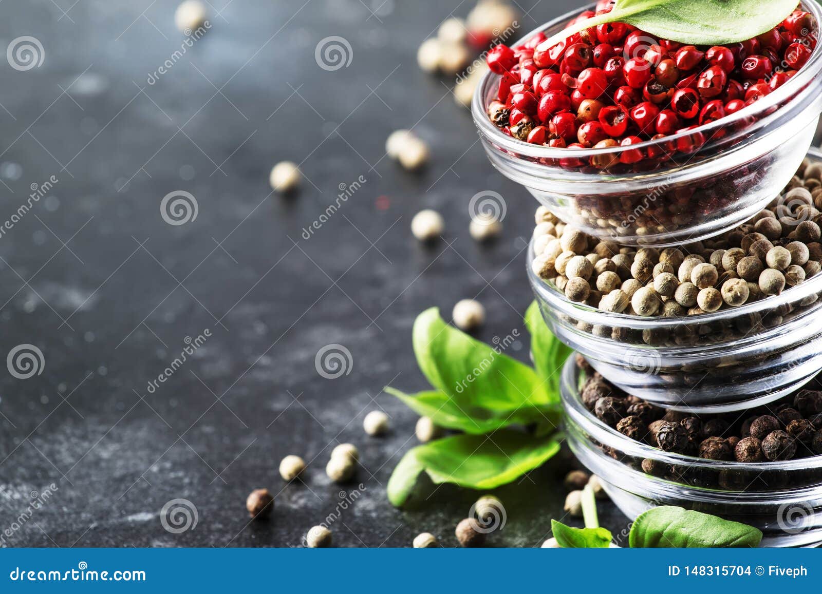 Black, White and Pink Rose Peppers in Bowls, Assorted Spices on Gray ...