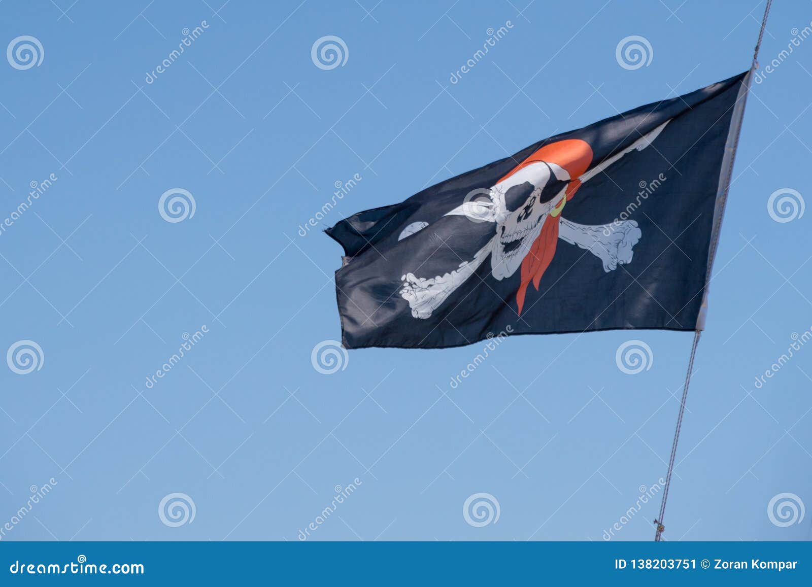 Black and White Pirate Flag is Flying on Blue Sky Stock Image - Image ...