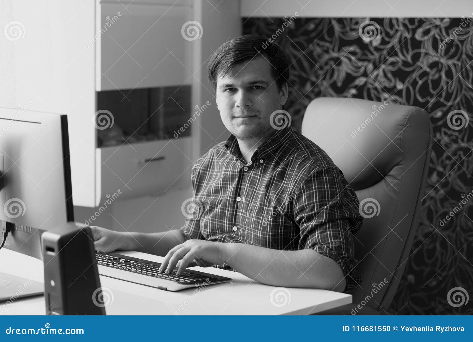 Black and White Portrait of Young Man Working on Computer at Home ...