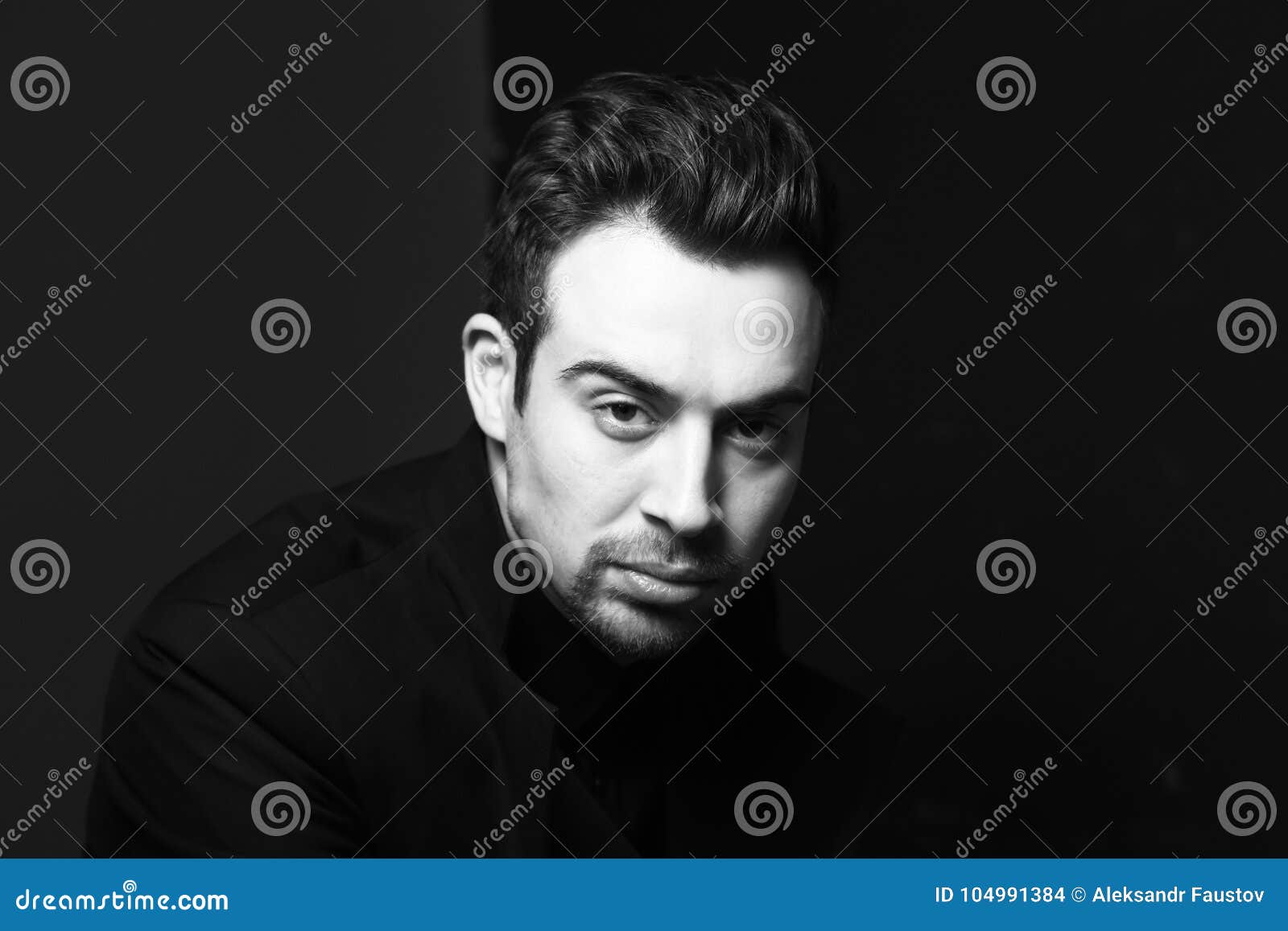Black and White Portrait of a Serious Young Handsome Man Dressed in ...