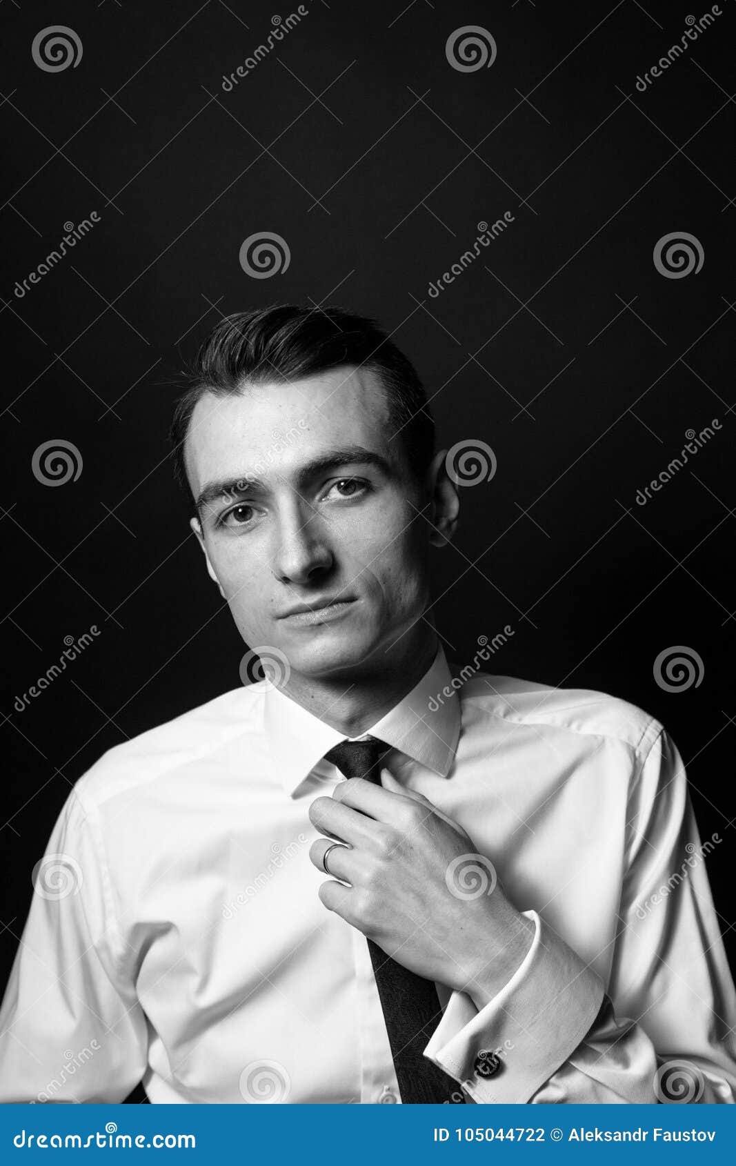 Black and White Portrait of a Young Man in a Shirt, Adjust His Tie ... Black and White Portrait of a Young Man in a Shirt, Adjust His Tie ...