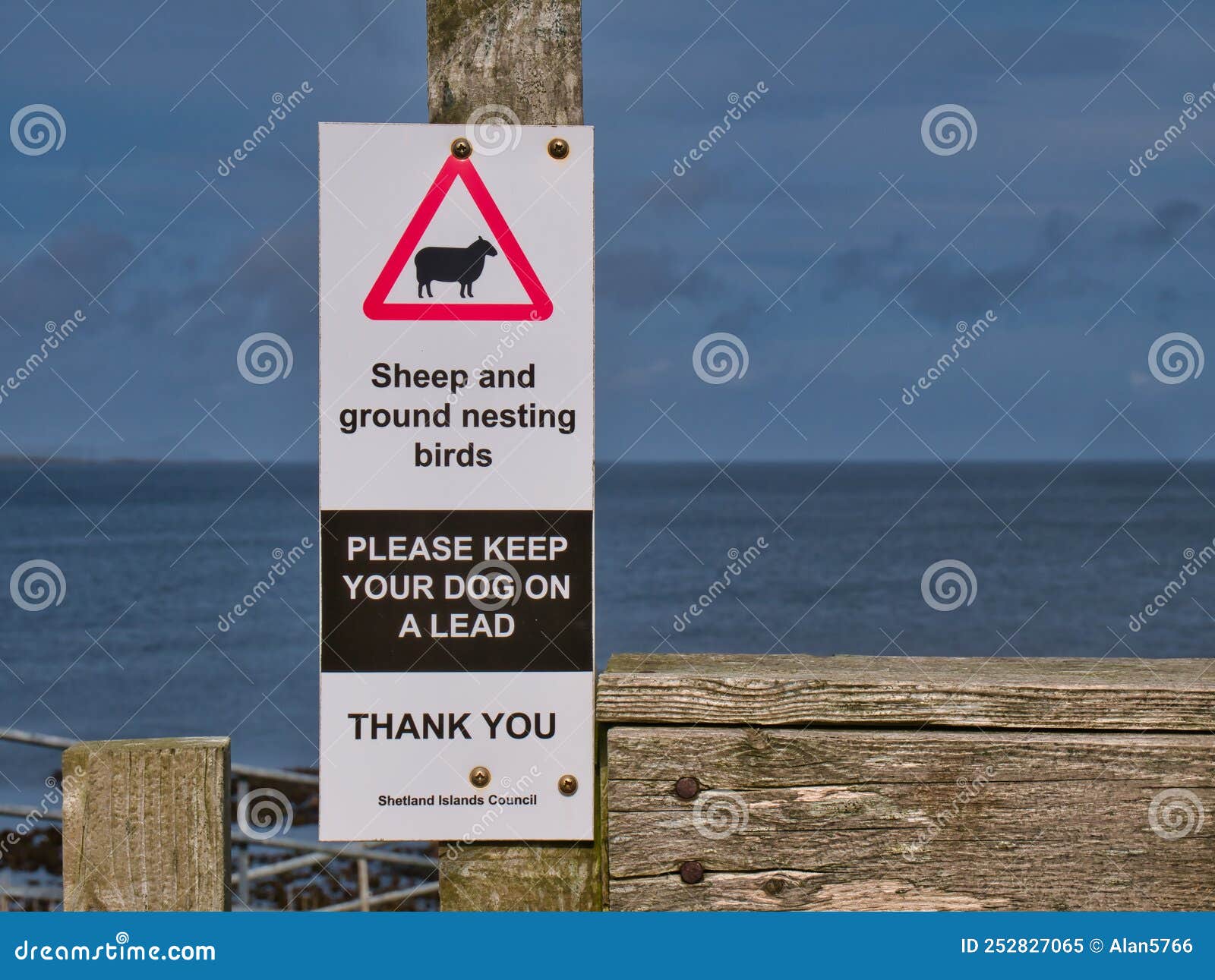 A Black and White Rectangular Sign with a Red Warning Triangle on a ...