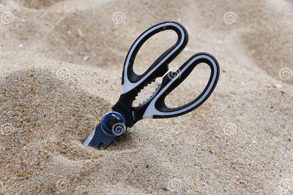 A Black and White Scissors Half-buried in the Sand Stock Image - Image of white, sharp: 329701329
