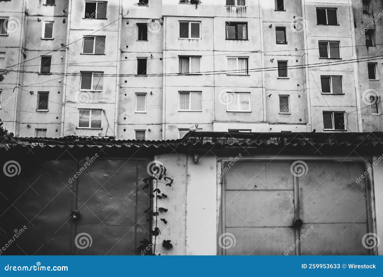 Black and White Shot of a Monotonous Post-soviet Building with Garages ...