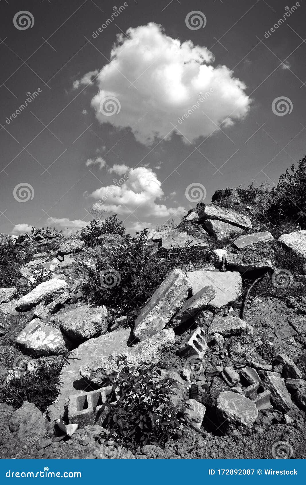 A Pile Of Rubble And Soil In The Foreground. In The Background A Mini ...