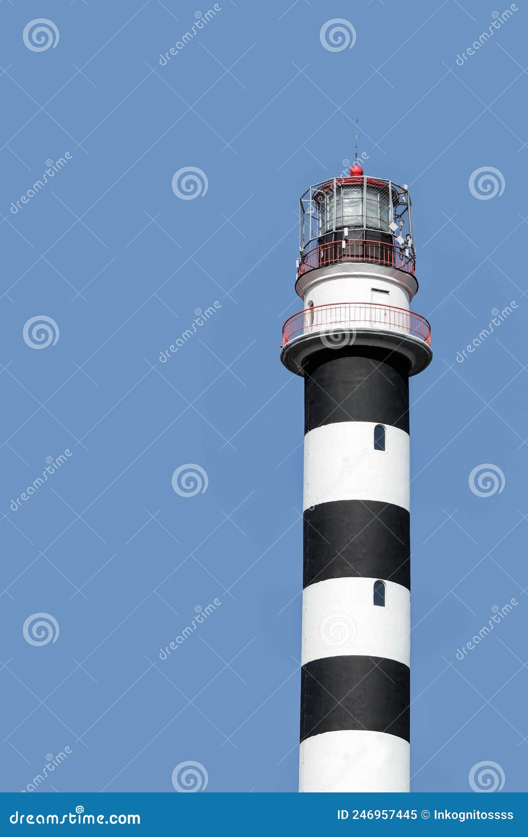 Black and White Striped Lighthouse on a Blue Background Stock Image ...