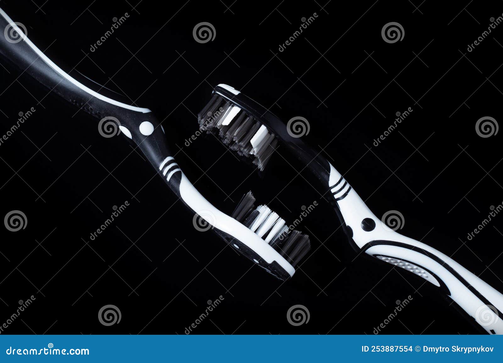 Black and White Toothbrushes Isolated on a Black Background Stock Photo ...