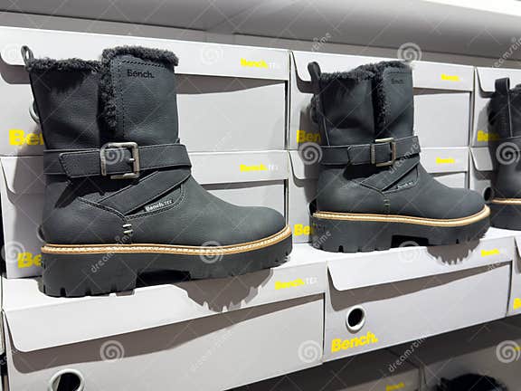 Black Winter Boots on Display Shelf with Box Packaging Editorial Stock ...