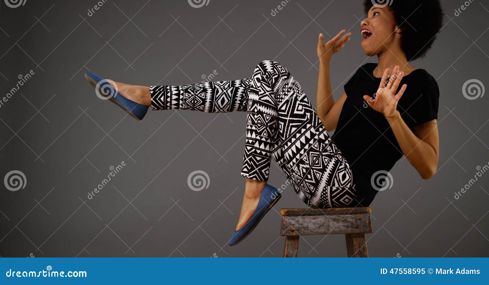Black Woman Dancing on Chair Stock Image - Image of beauty, indoors ...