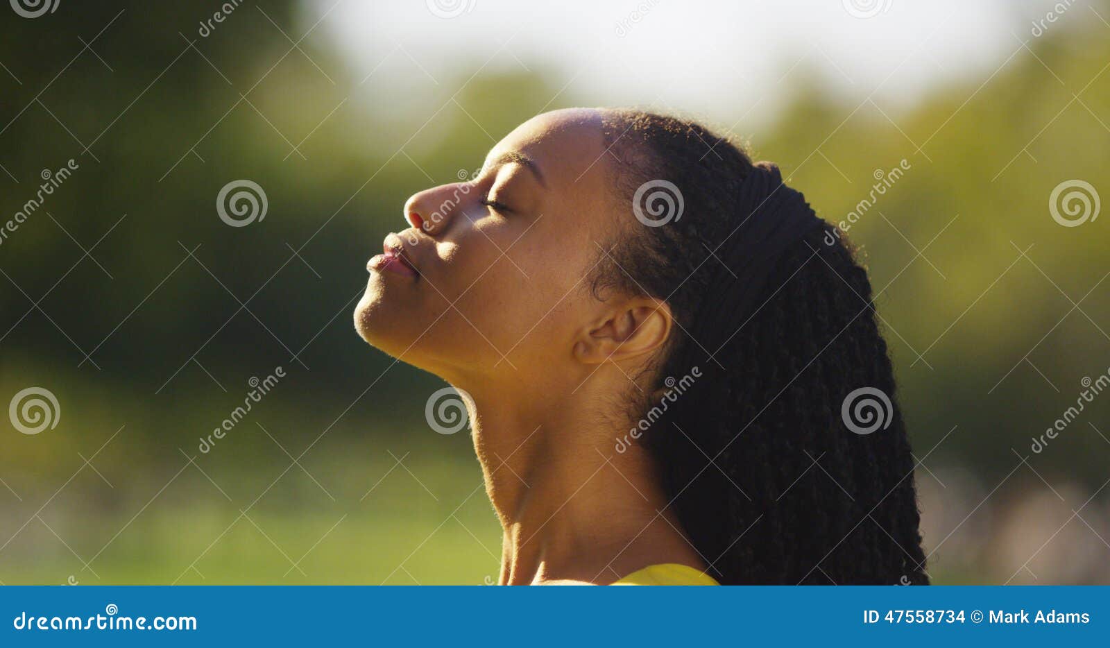 Black Woman Feeling the Sun Shine on Her Face Stock Photo - Image of ...