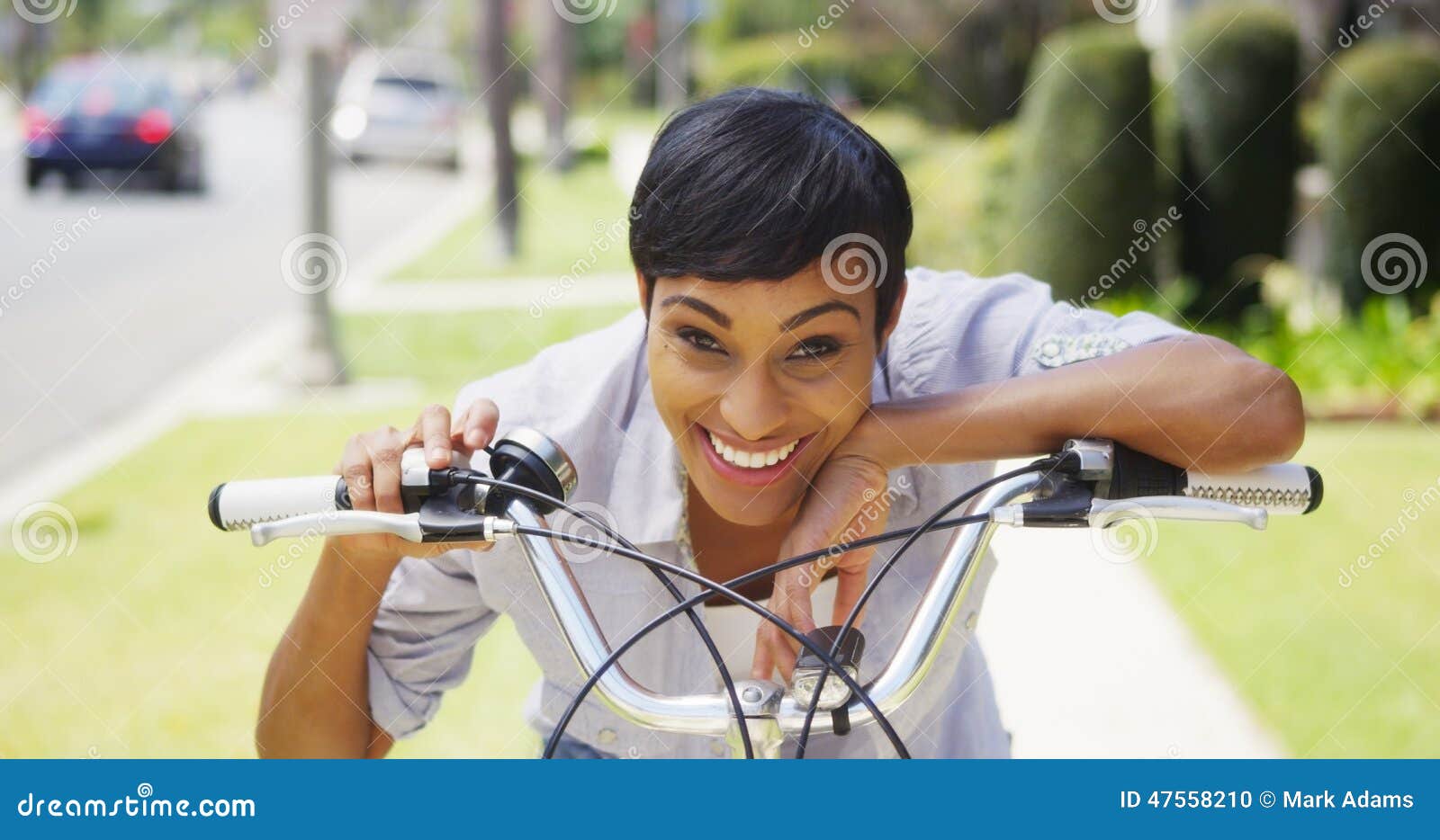 Black Woman Ringing Bicycle Bell and Smiling Stock Photo - Image of ...