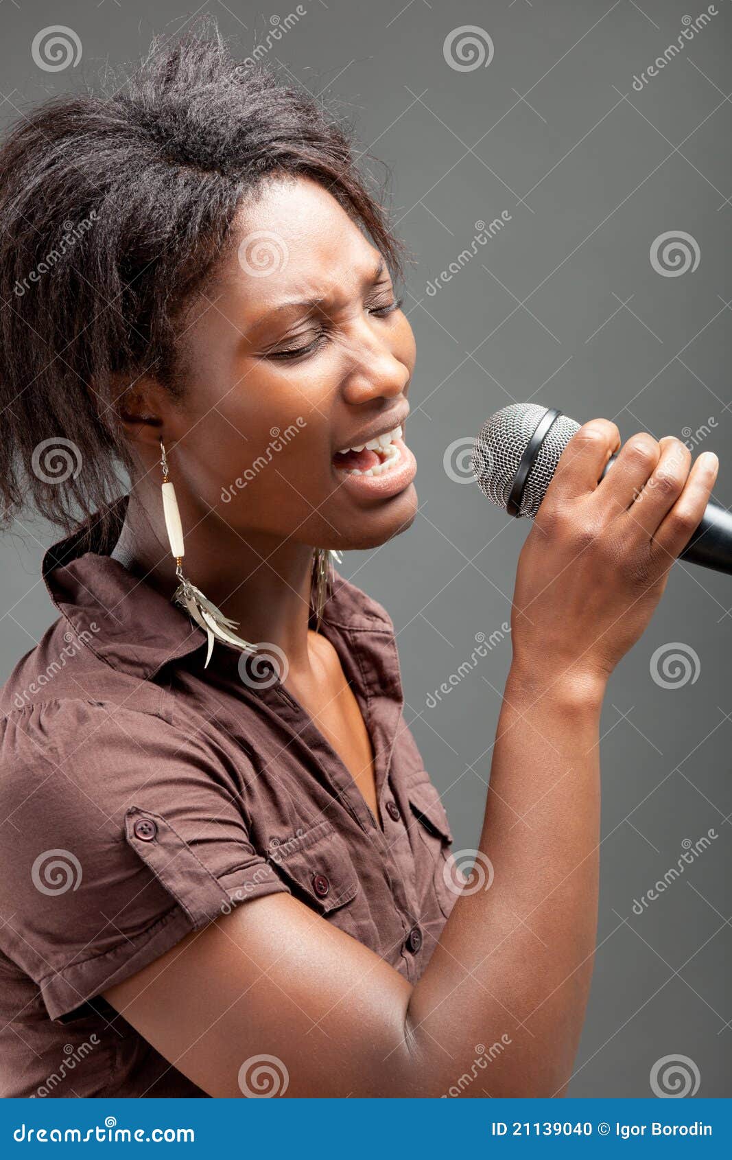 Black Woman Singing Into Microphone Stock Photo - Image: 21139040