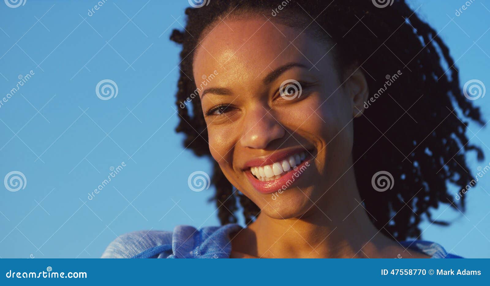 Black Woman Smiling and Laughing Stock Photo - Image of holding, girl ...