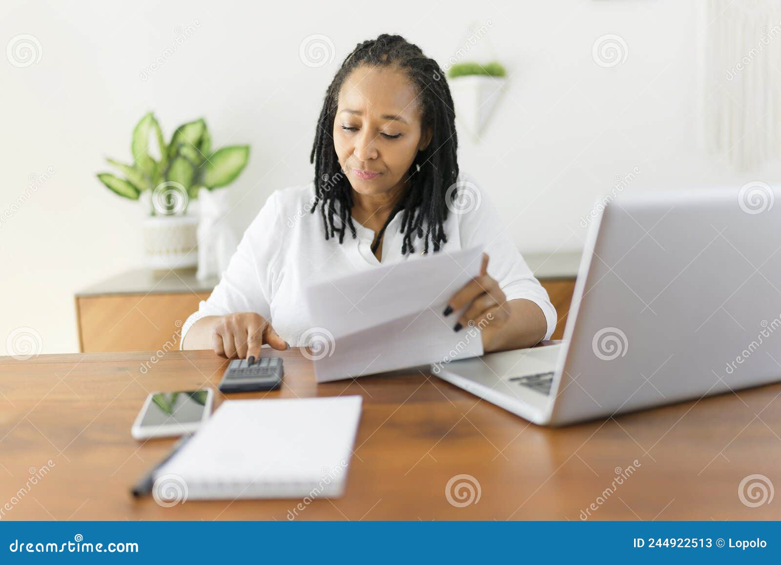 Black Woman Using Computer in Modern Kitchen Interior Stock Image ...