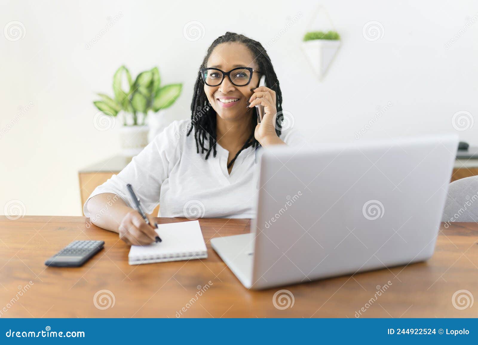 Black Woman Using Computer in Modern Kitchen Interior Stock Photo ...