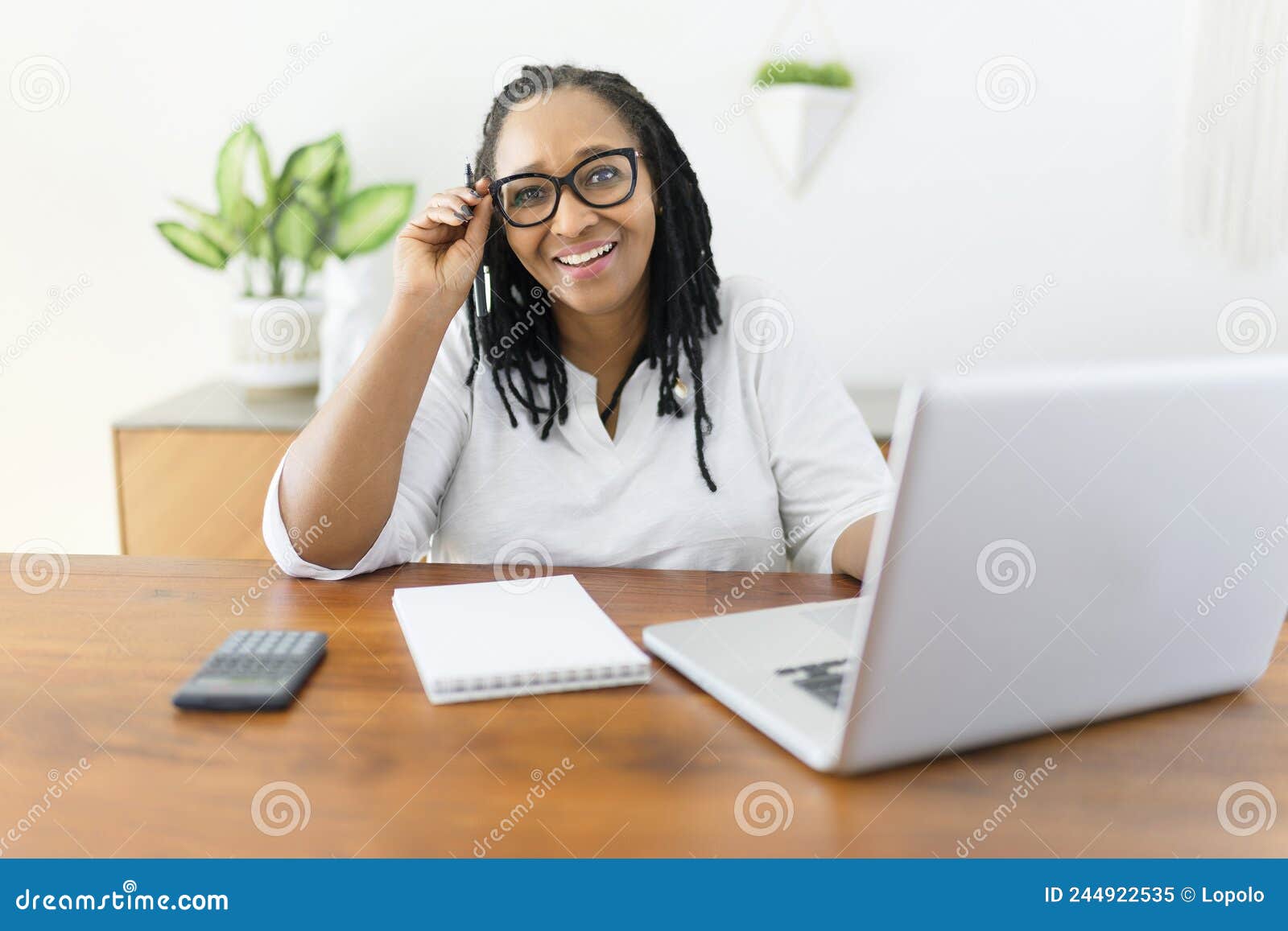 Black Woman Using Computer in Modern Kitchen Interior Stock Image ...