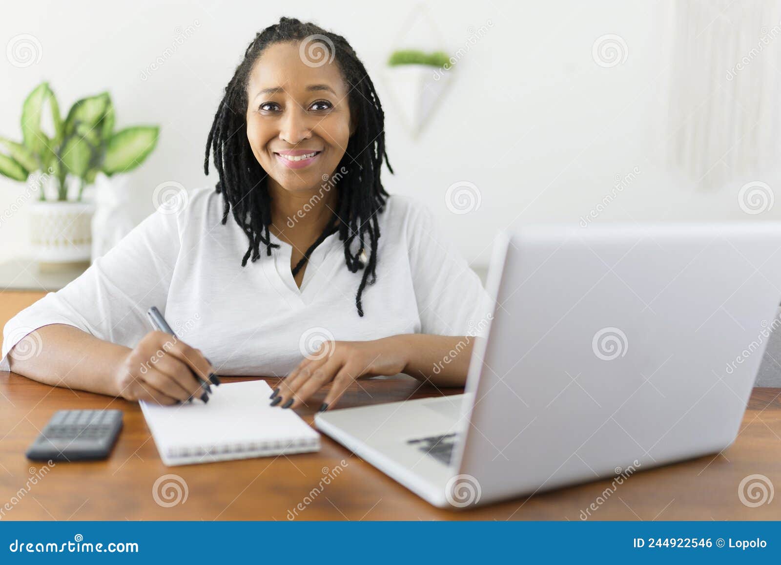 Black Woman Using Computer in Modern Kitchen Interior Stock Photo ...