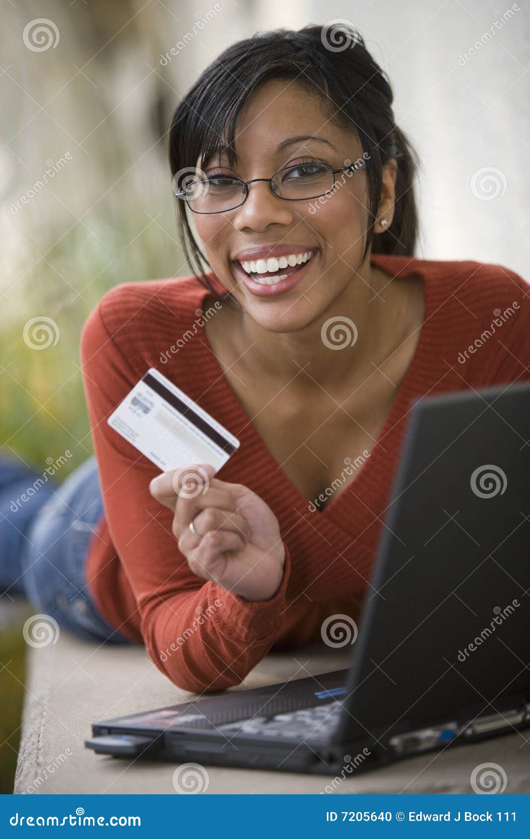 Black Woman Using Credit Card and Laptop Outside Stock Photo - Image of ...