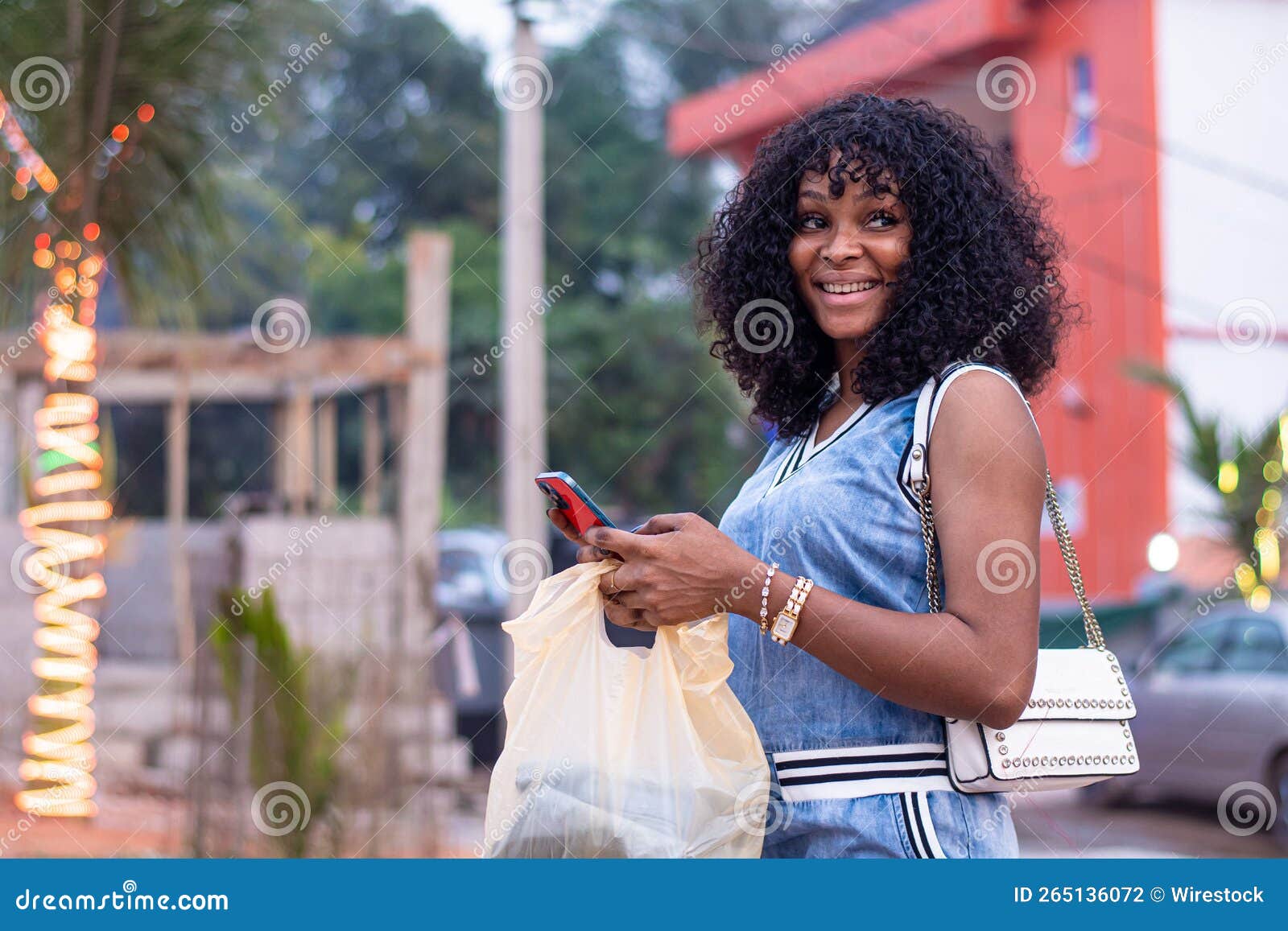 Black Woman Using Her Phone Outdoors Stock Photo - Image of black, text ...