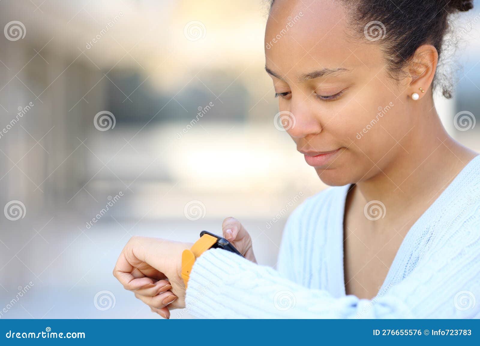 Black Woman Using Smartwatch in the Street Stock Photo - Image of email ...