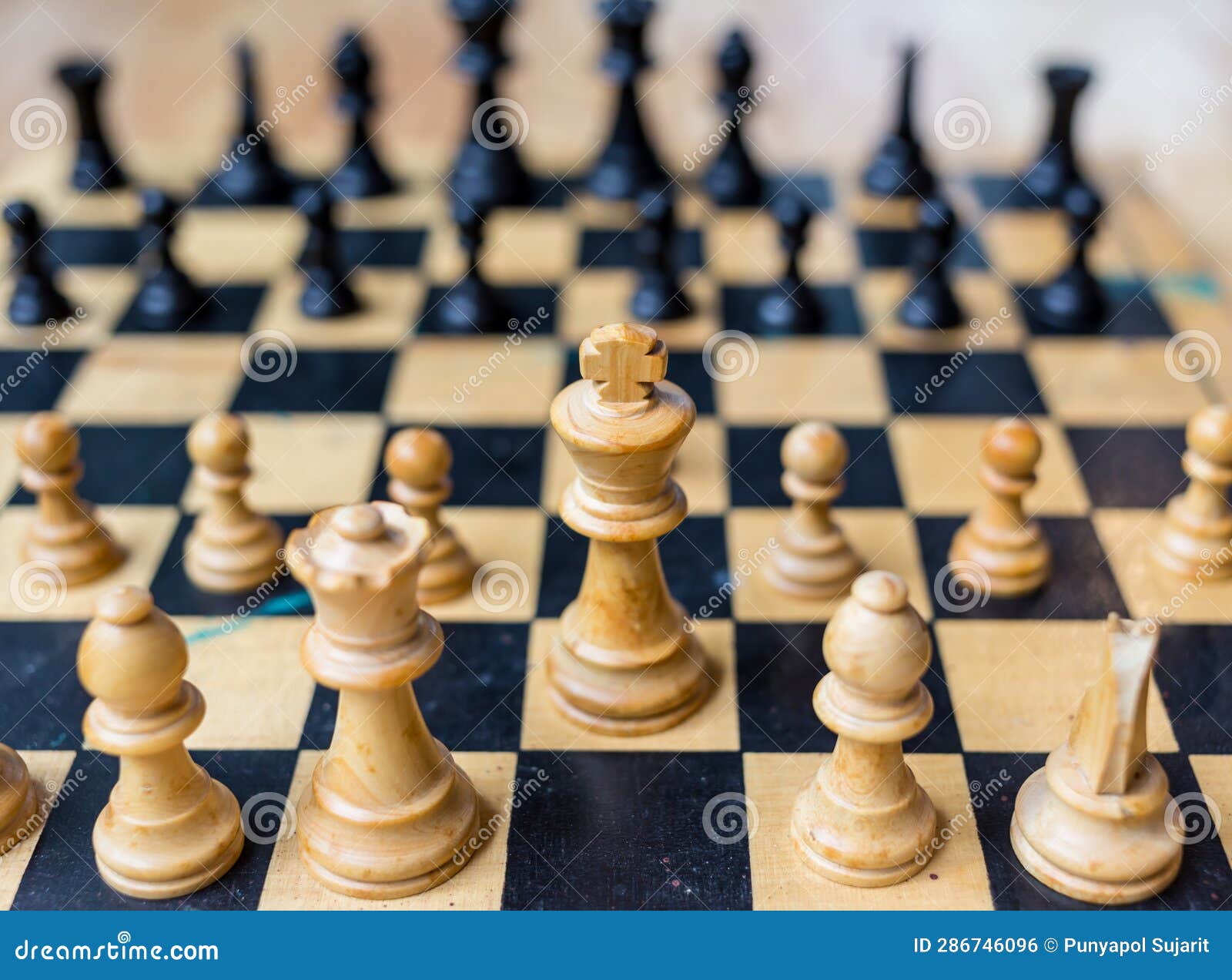 Black and Wooden Chess on a Wooden Plate Stock Photo - Image of ...