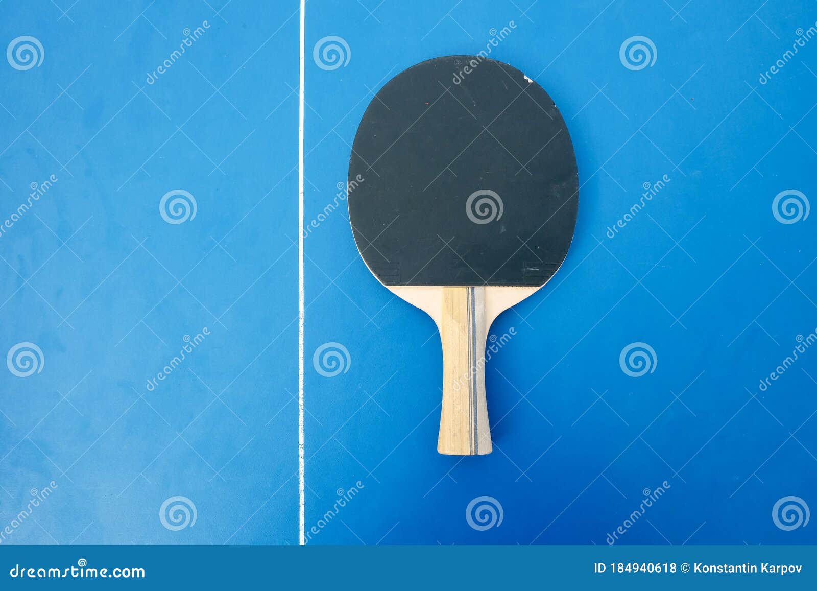 Black Wooden Racket for Ping Pong Lying on the Blue Table Top View ...