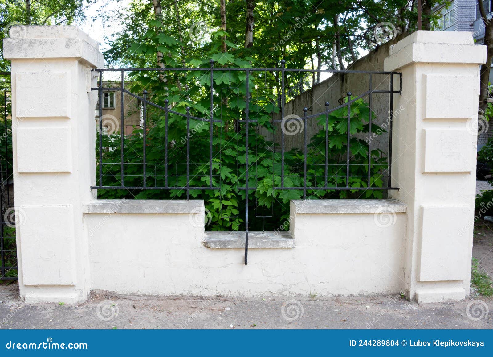 Black Wrought Iron Fence between Stone Pillars Stock Photo - Image of ...