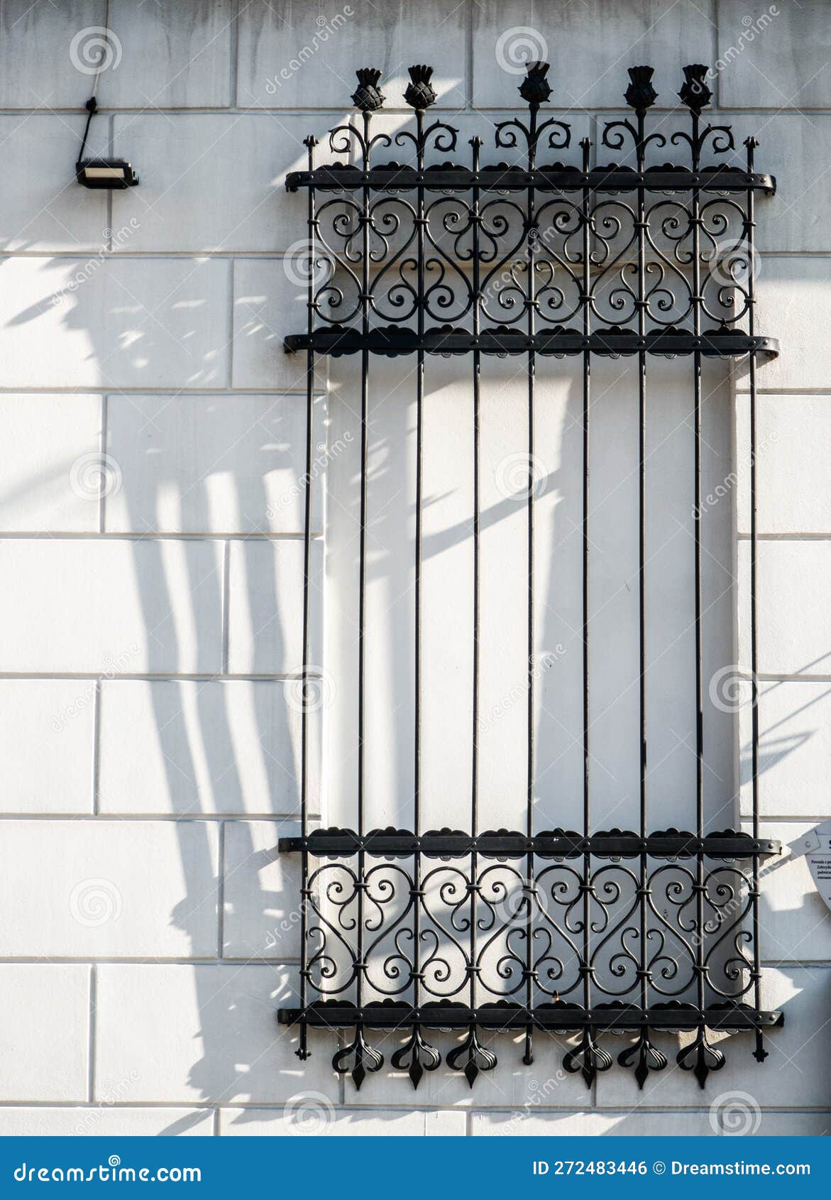 Black Wrought Iron Grating on a White Wall. Architecture of Krakow ...